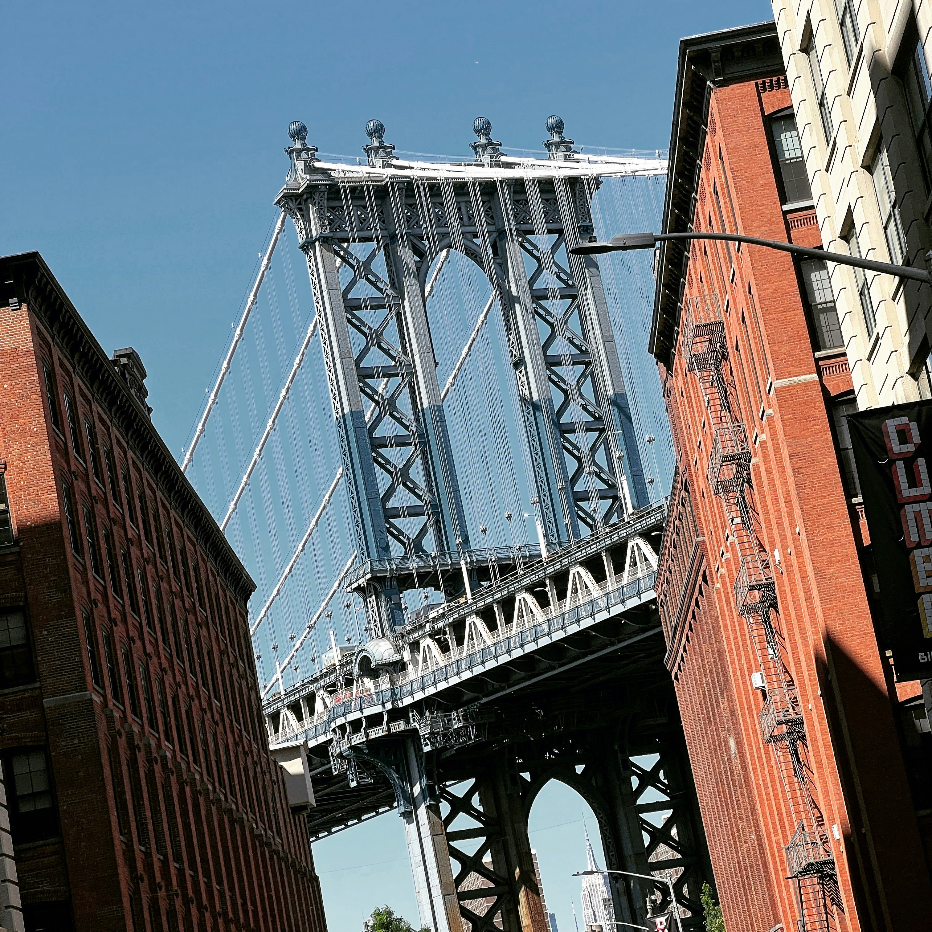 A tall bridge spanning over a city street photo – Free Arch Image on ...