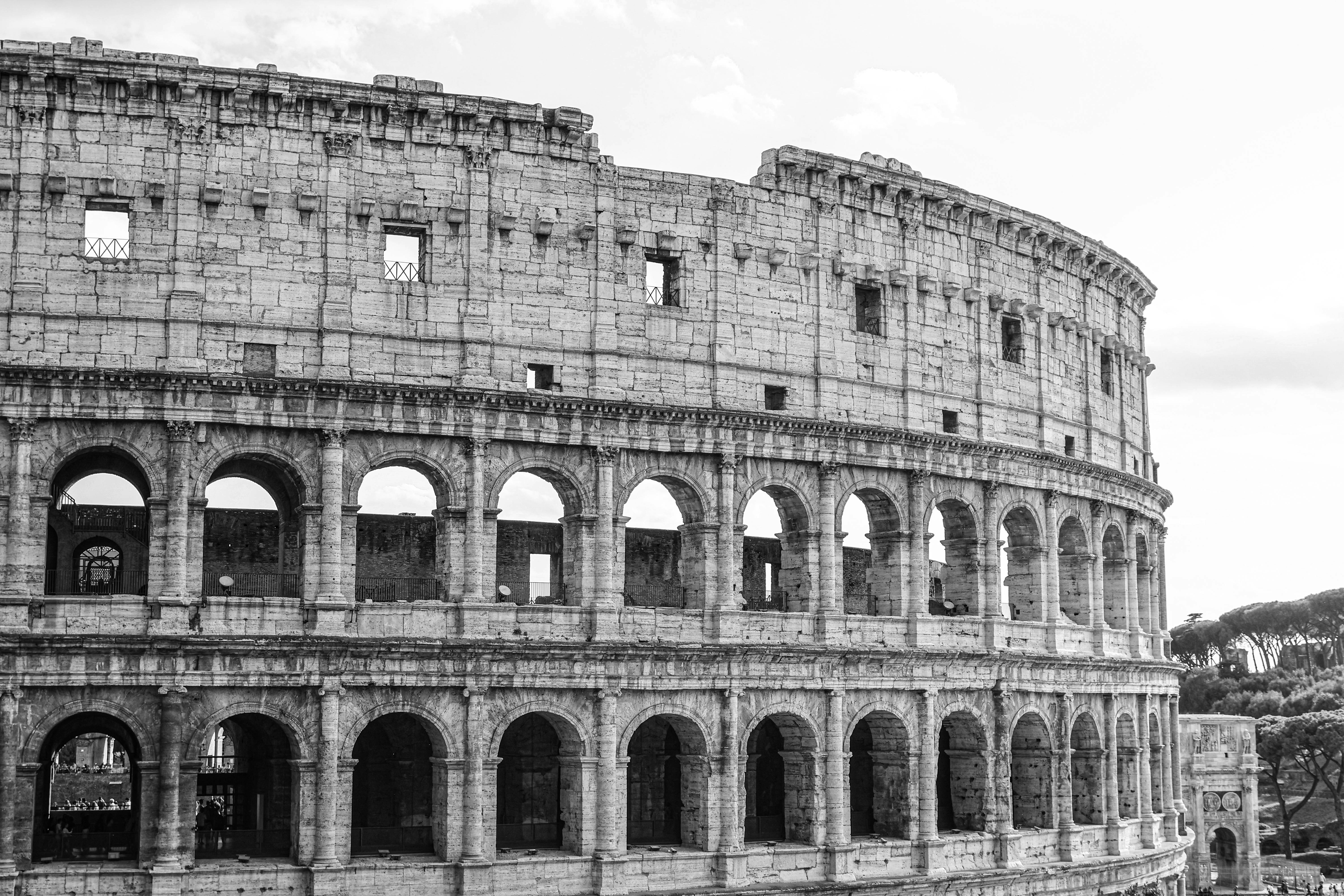 Arched Echoes of the Colosseum: A Quiet Facade in Monochrome