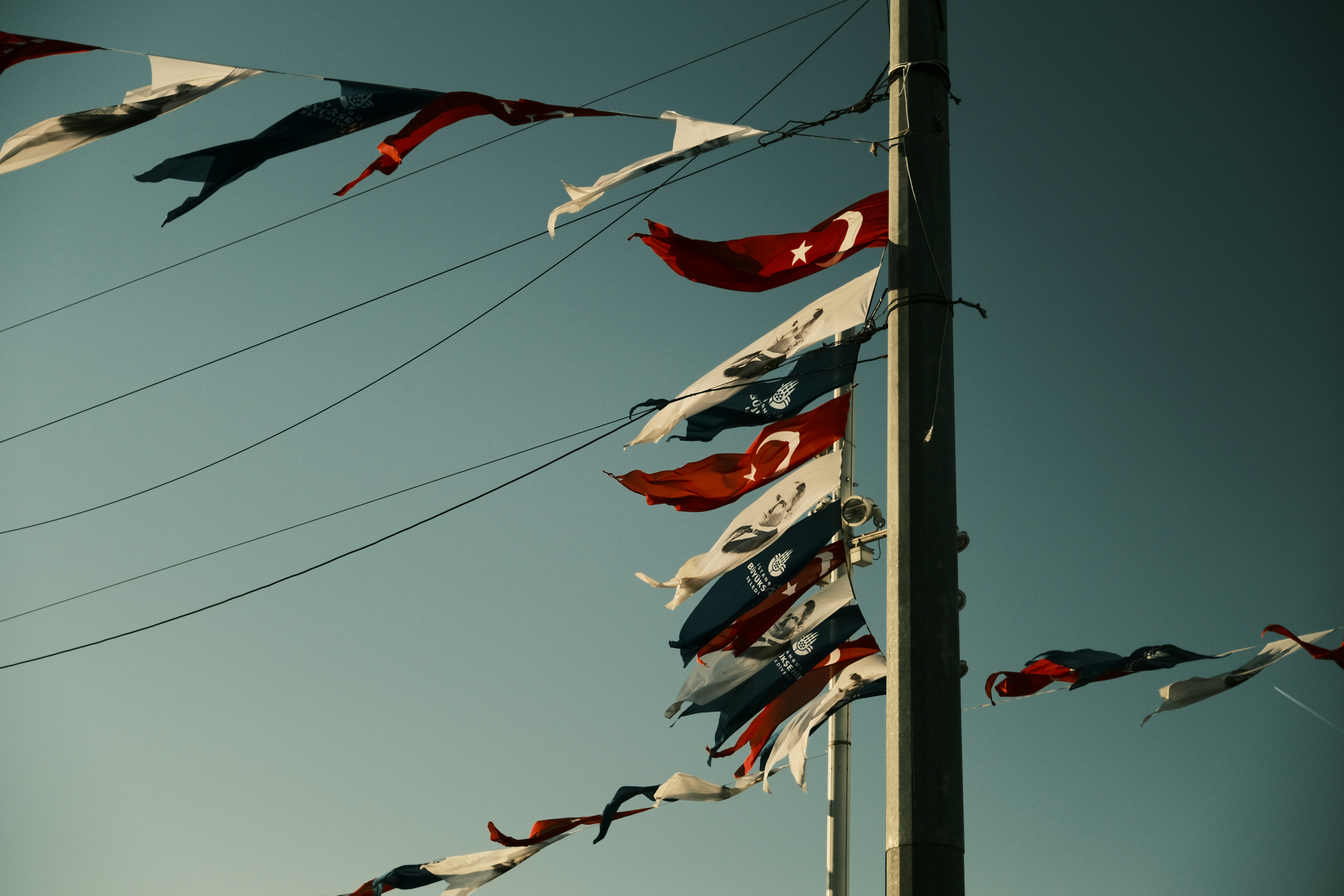 A bunch of flags that are on a pole photo – Free İstanbul Image on Unsplash