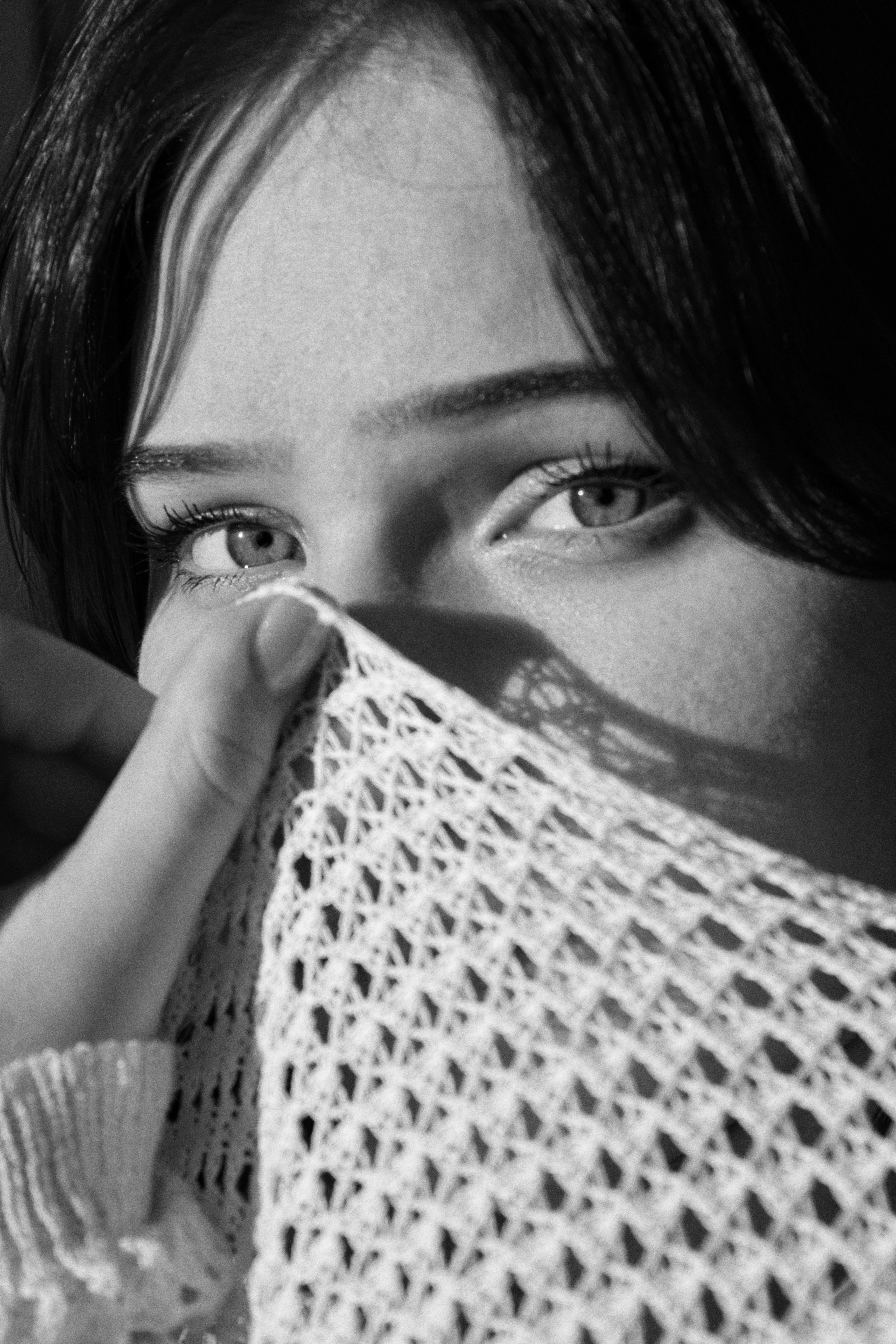 A woman covering her face with a crochet shawl photo – Free Woman Image ...