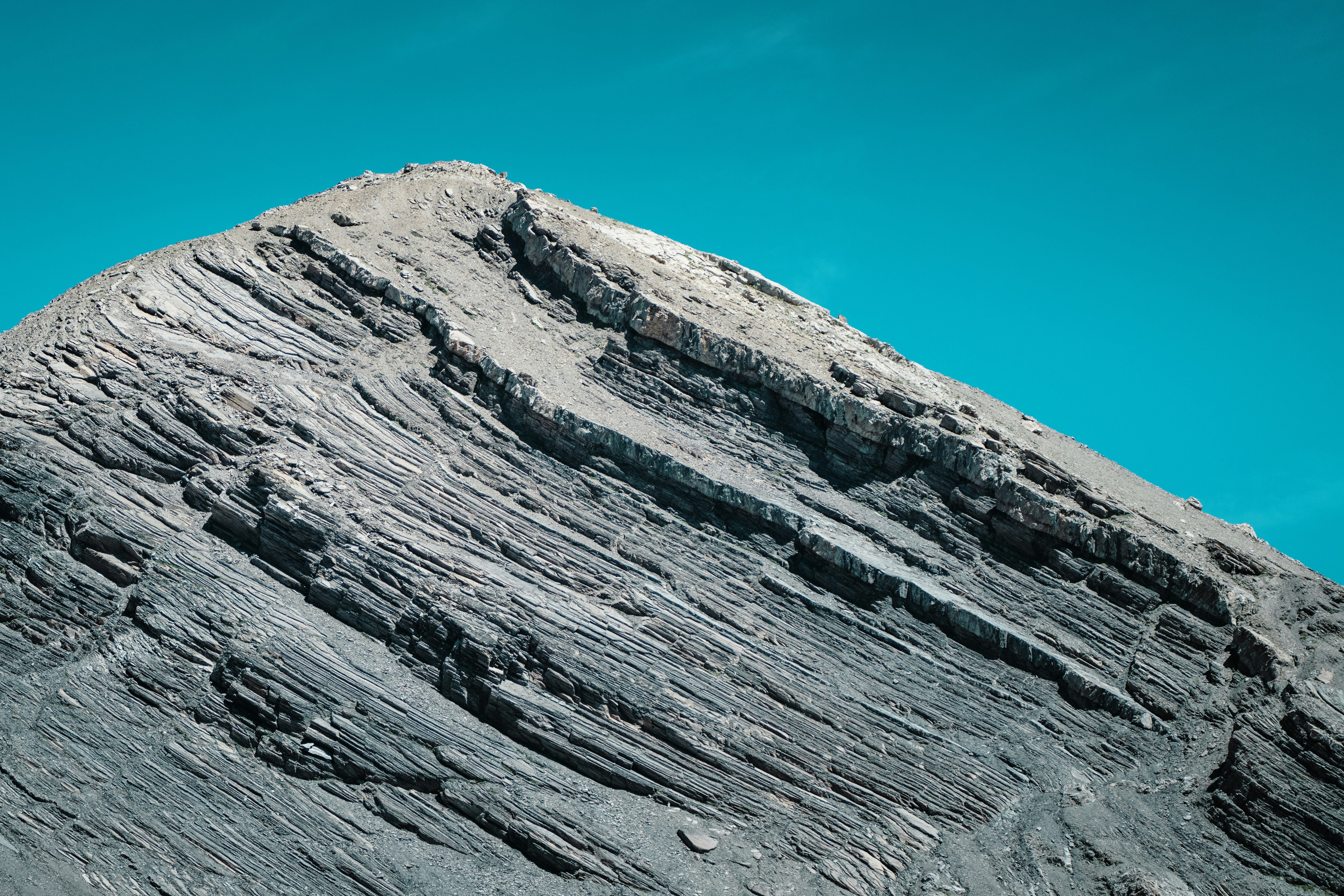 Teal Sky Over Striated Ridge