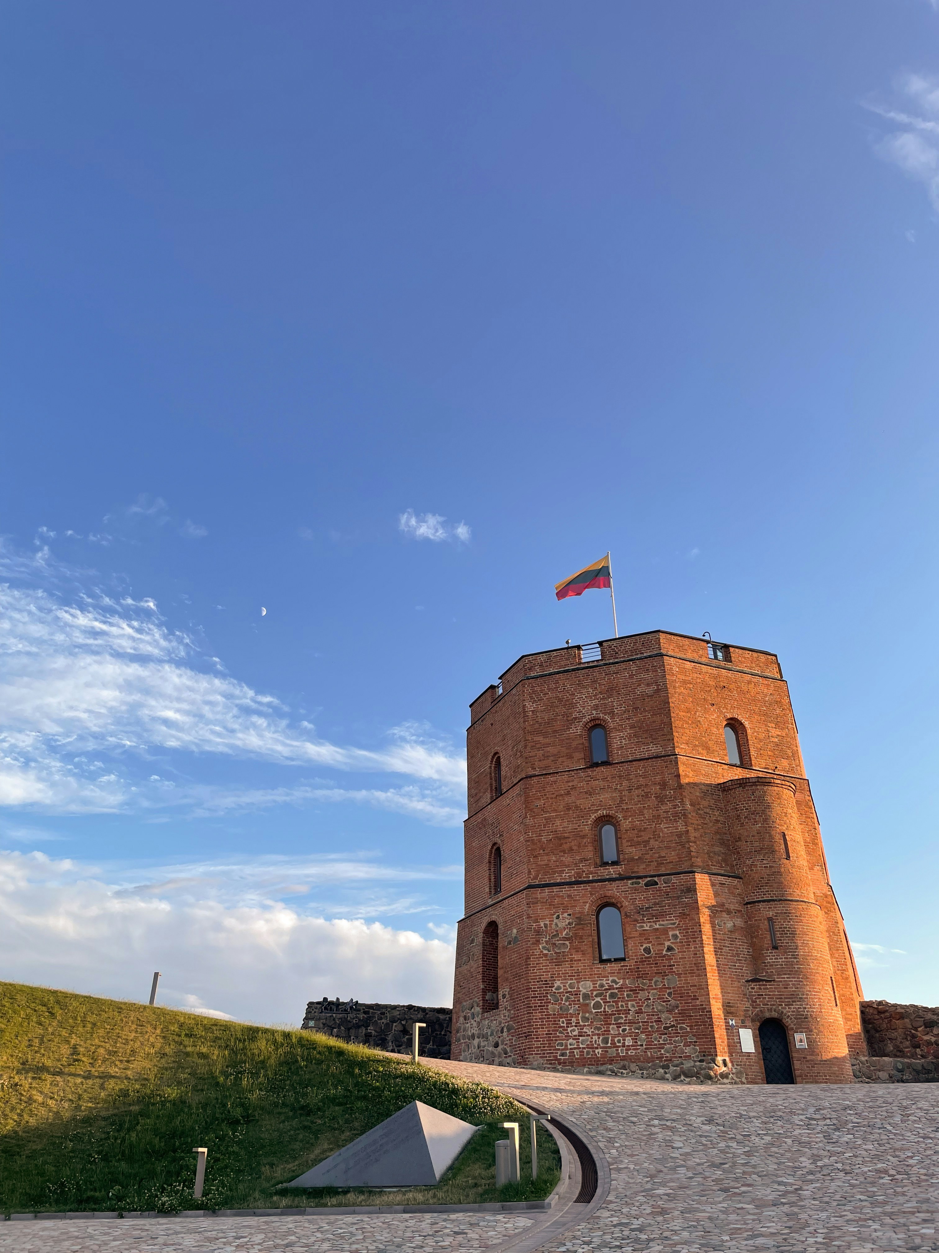 Red-Brick Sentinel: A Tower Against a Cerulean Sky