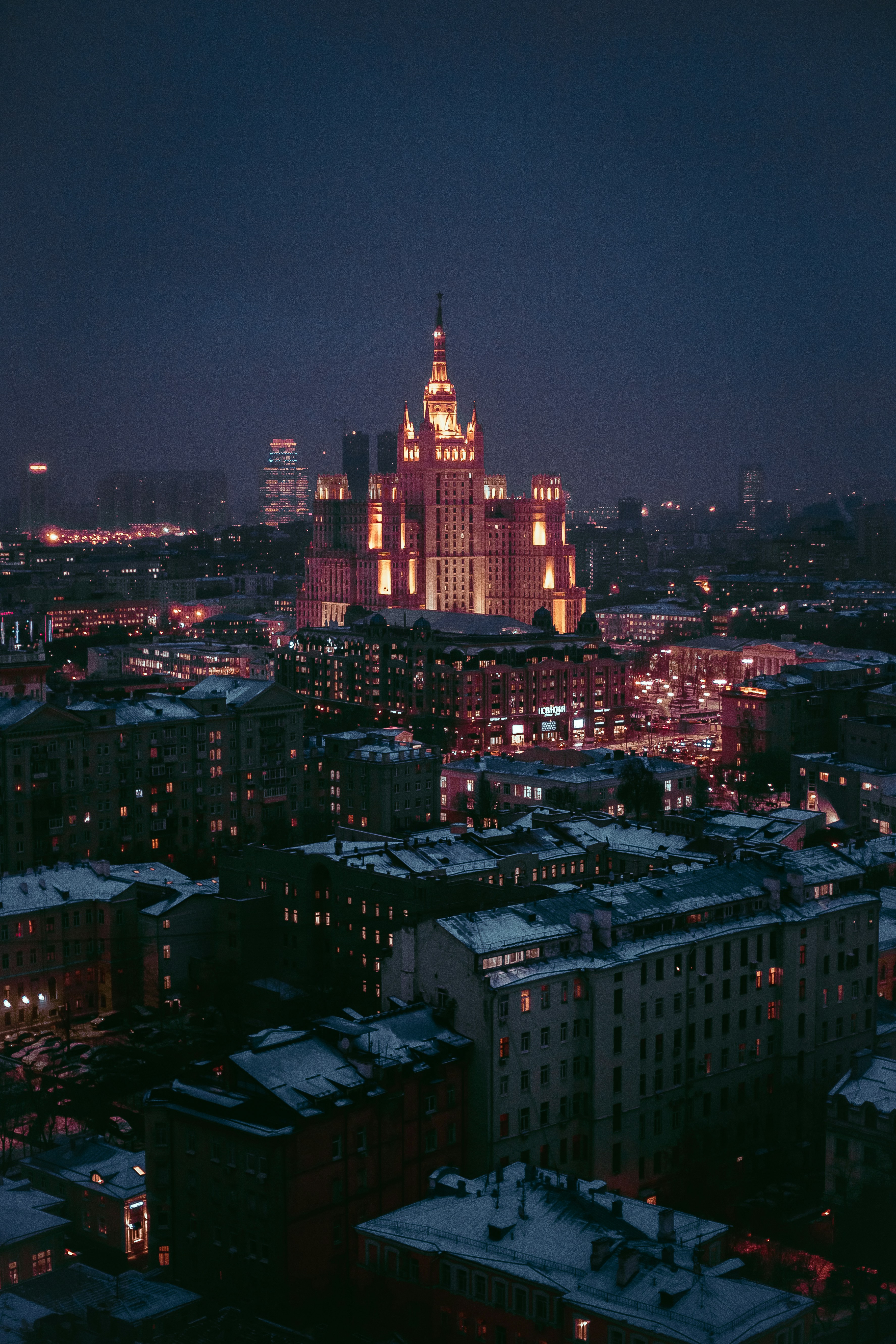 Spirelight Above the Snow: A Dusk Cityscape