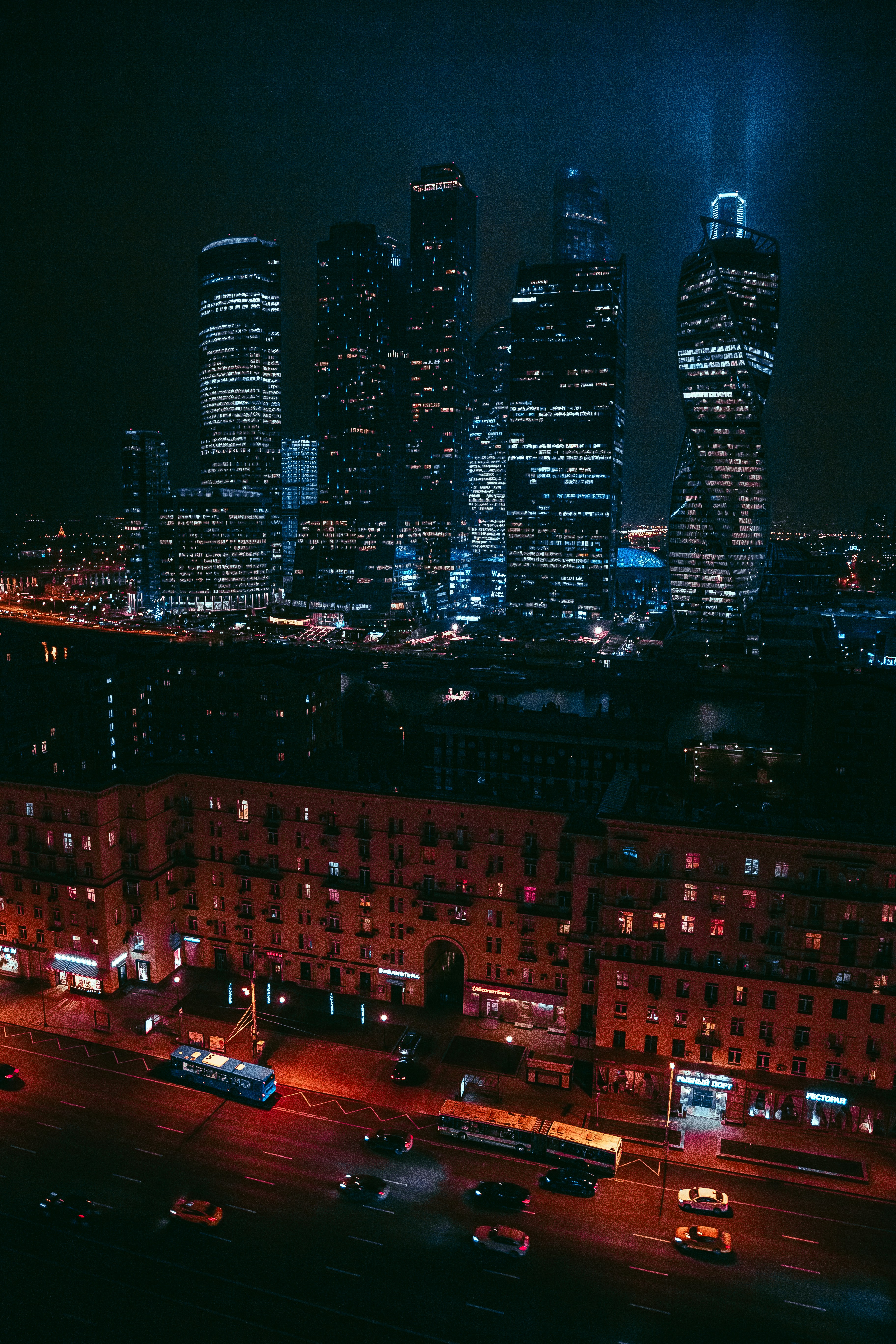 Blue Beacons Over a Red-Brick Night Boulevard