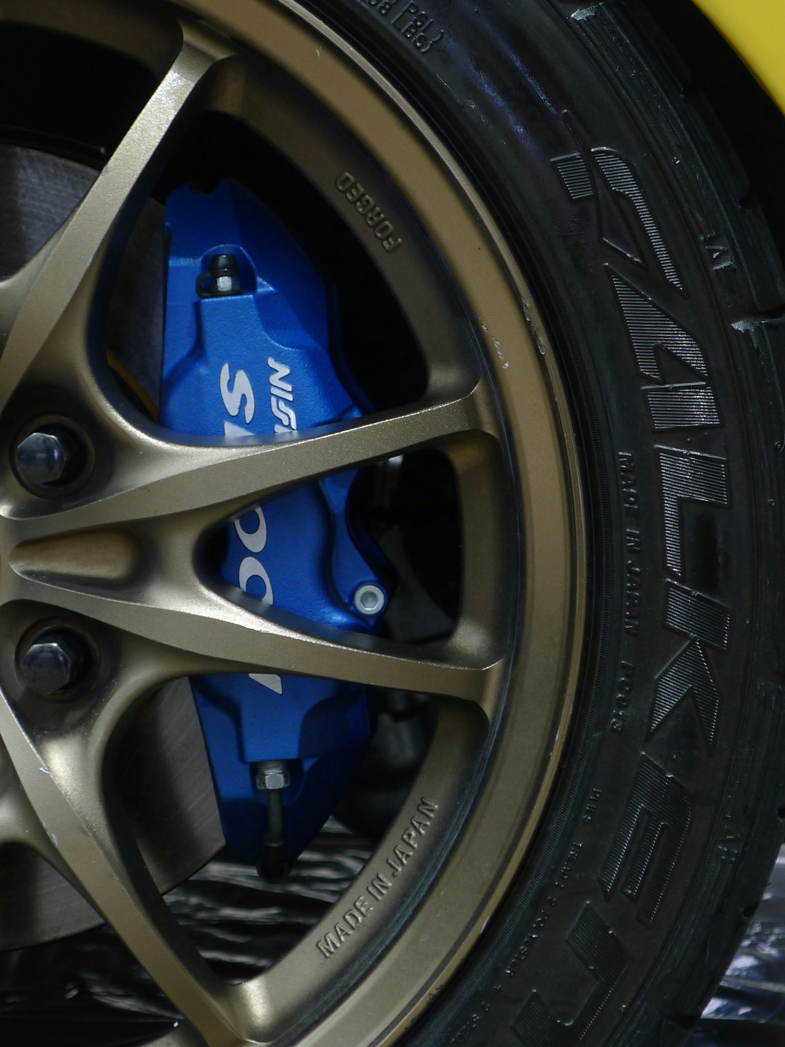 Blue Brake Caliper Peeking Through Alloy Spokes
