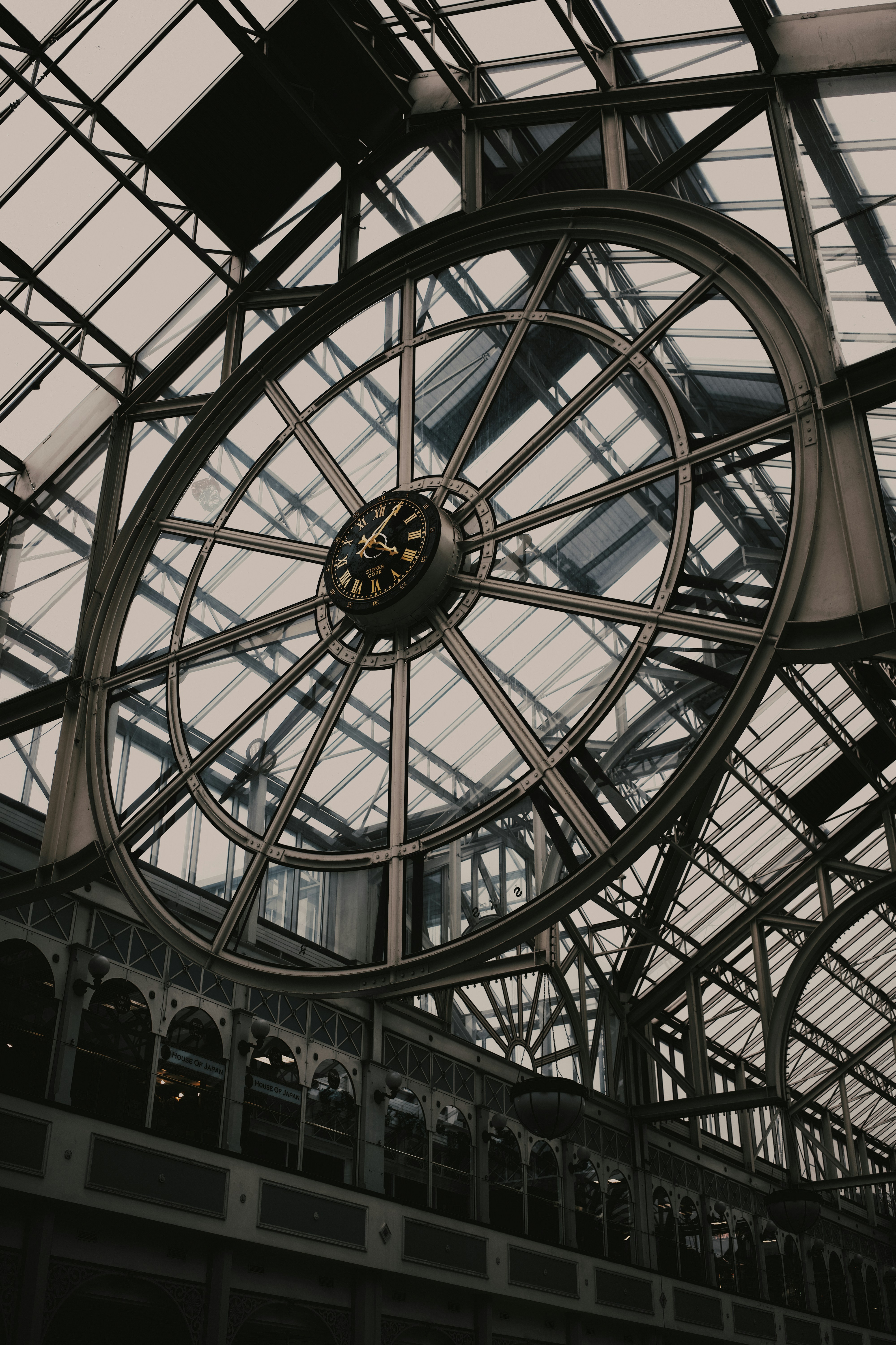 Timekeeper in Glass: The Clock Wheel under a Steel-and-Glass Canopy