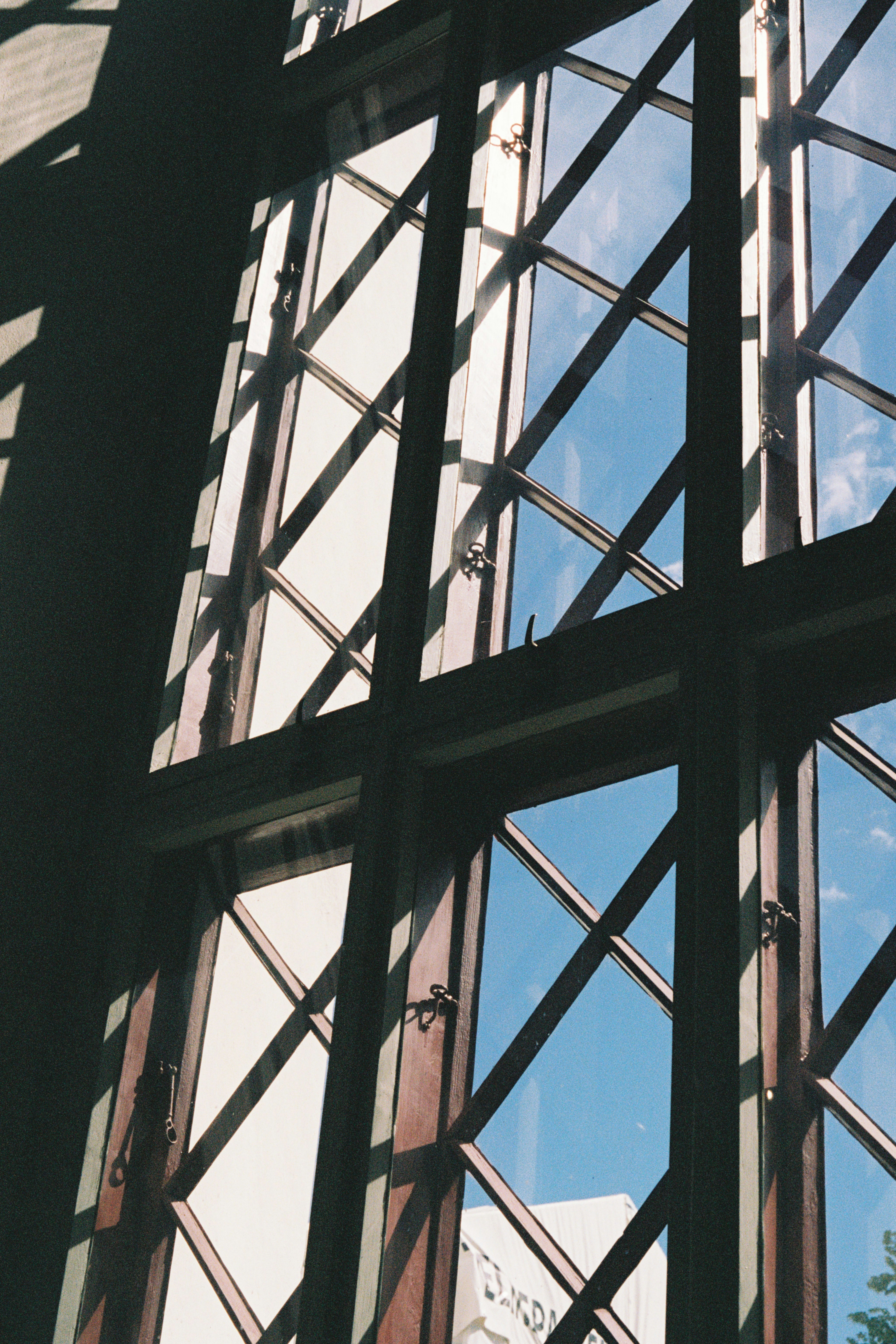 A view of the outside of a building through a window photo – Free ...