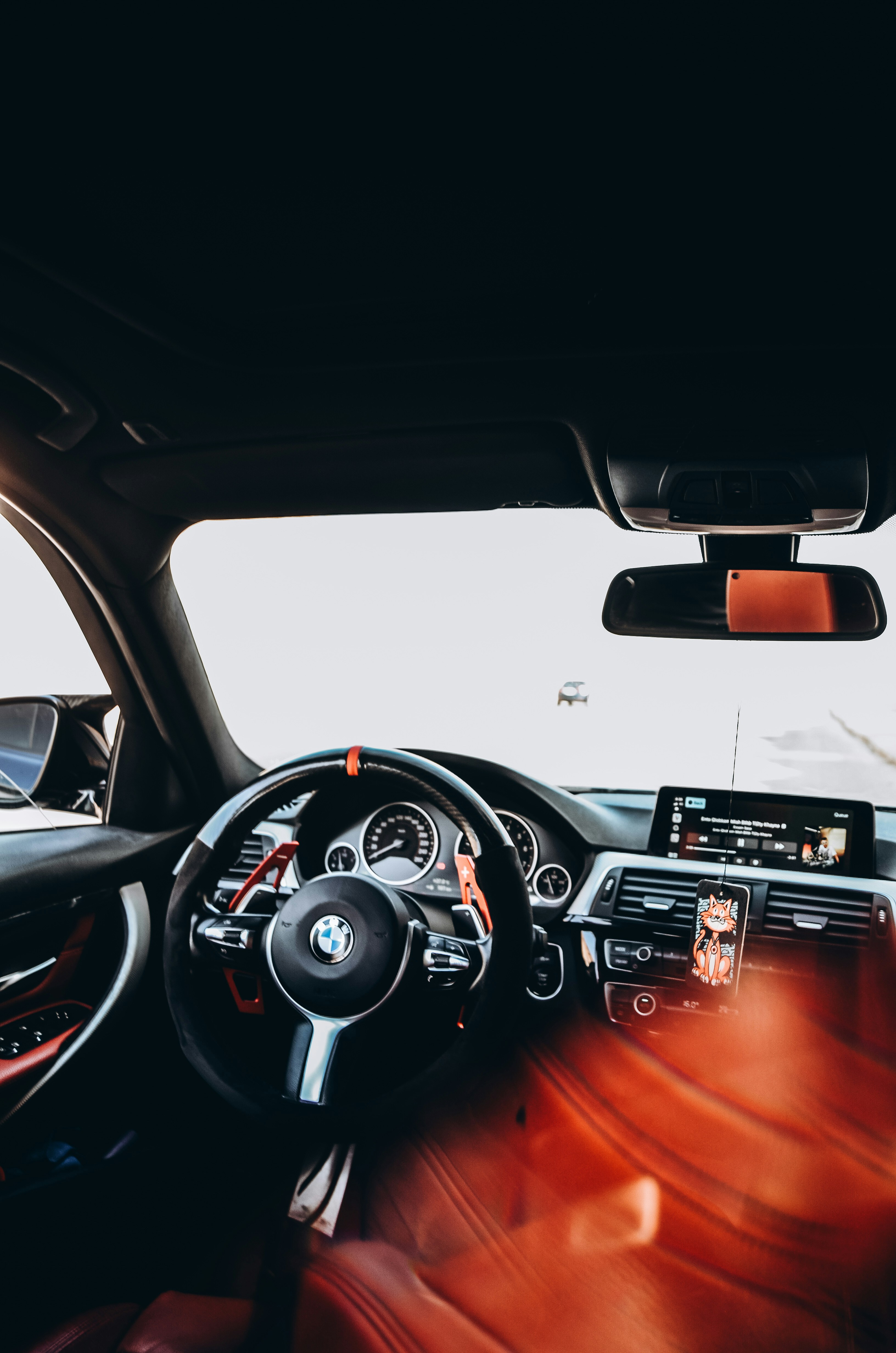 The interior of a car with a dashboard and steering wheel photo – Free ...