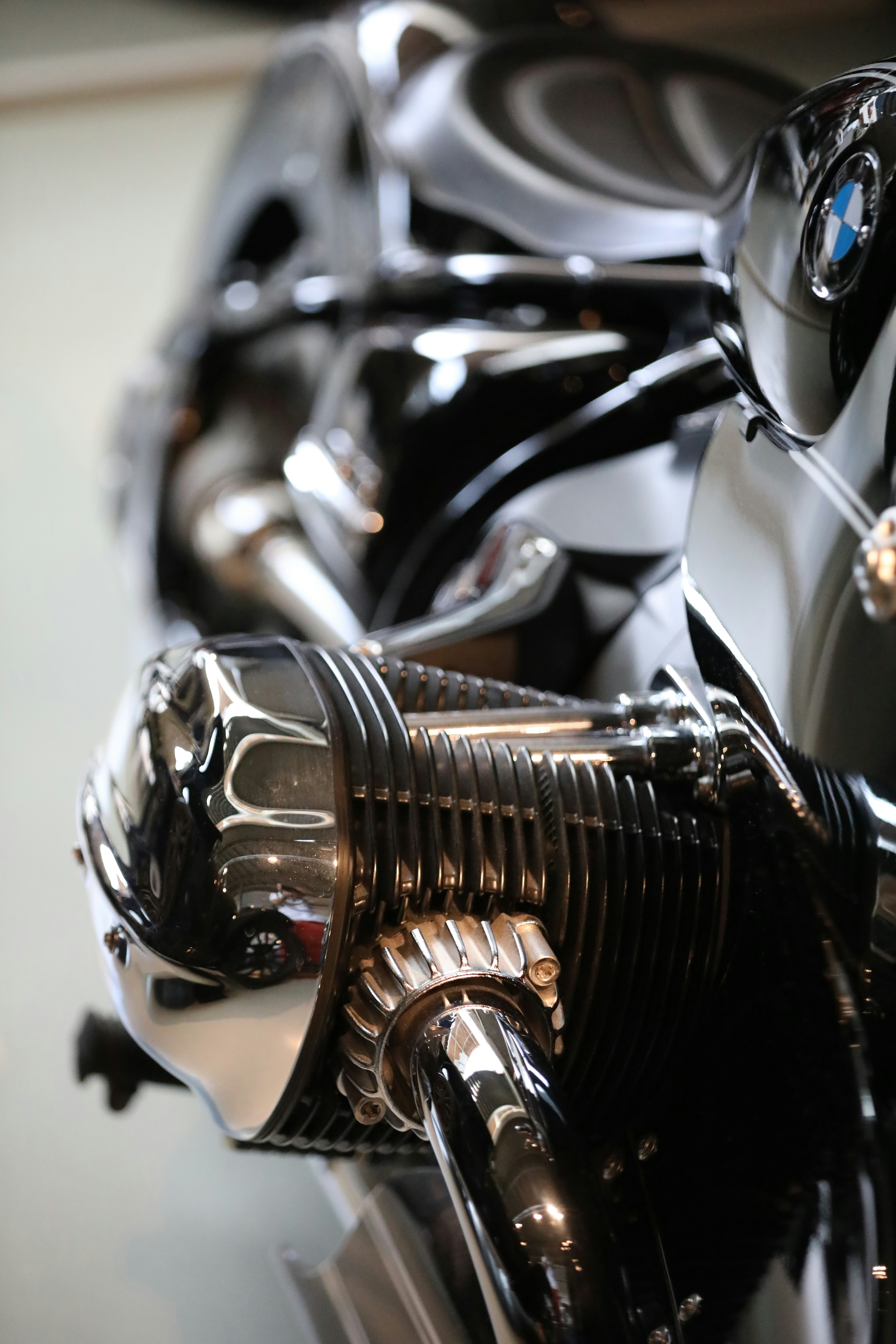 Chrome Contours: Close-Up of a BMW Boxer Engine Gleaming Between Glossy Black Panels