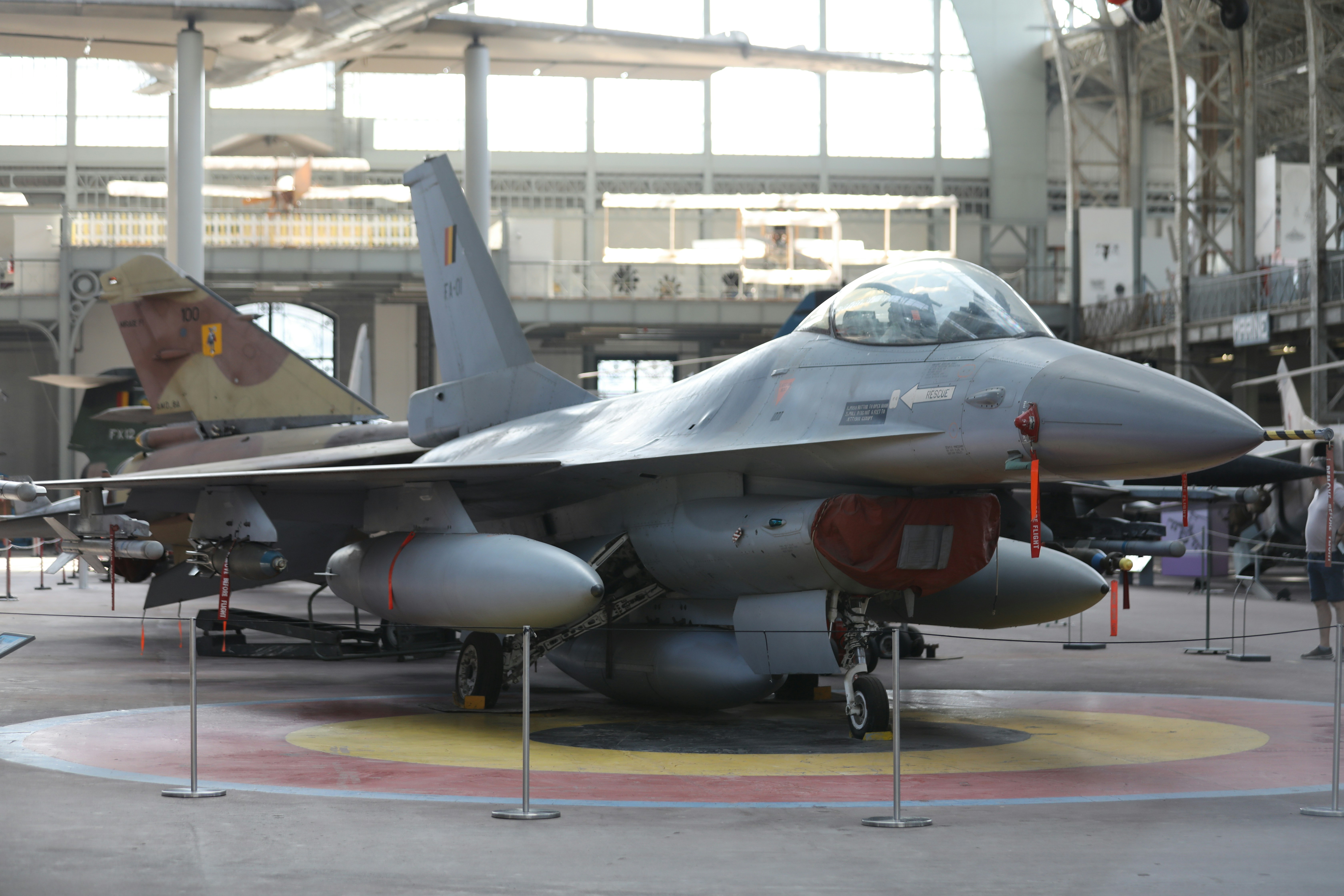 A fighter jet sitting on display in a museum photo – Free Aircraft ...