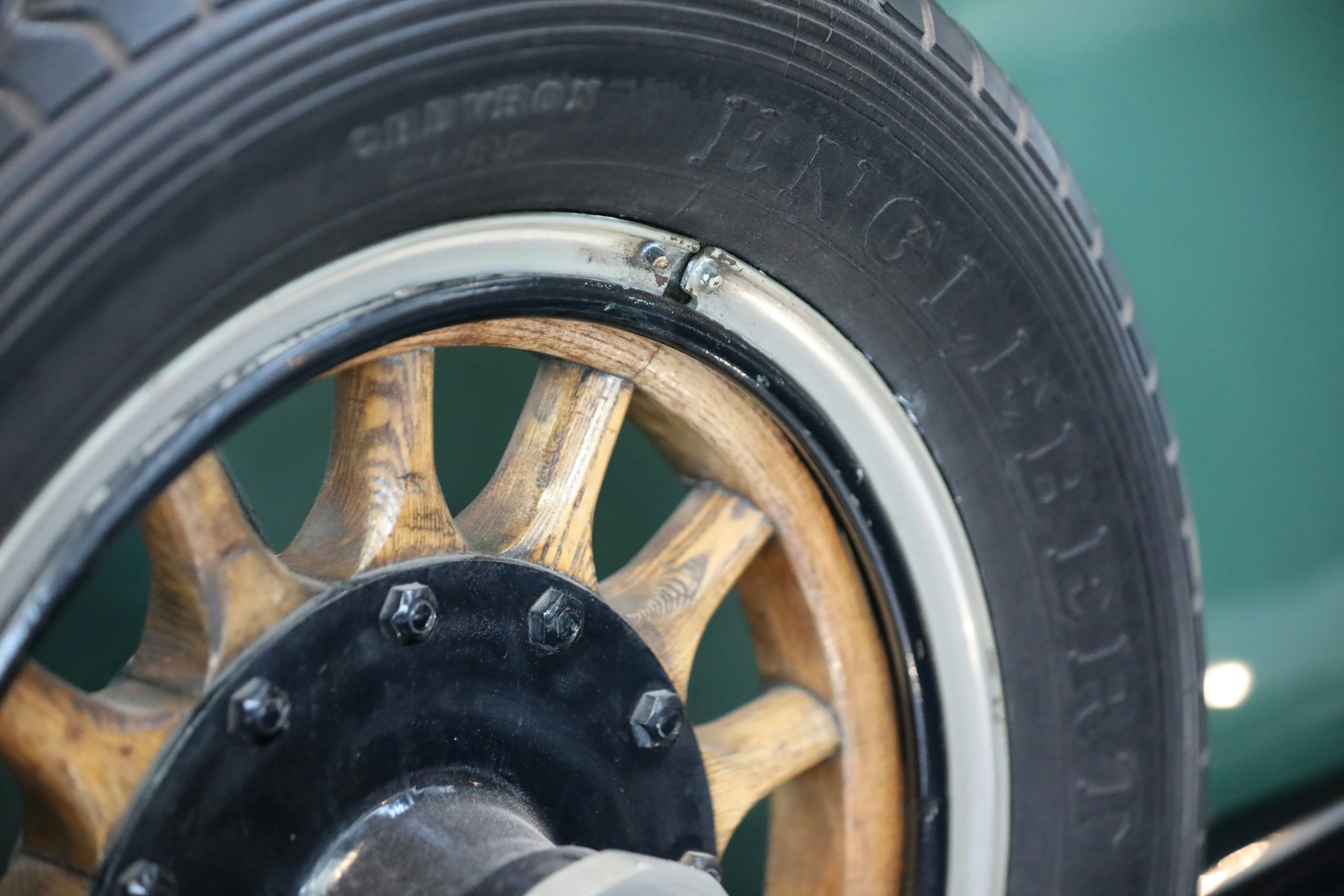 Spokes in Time: A Close-Up of a Vintage Wooden-Wheel Tire