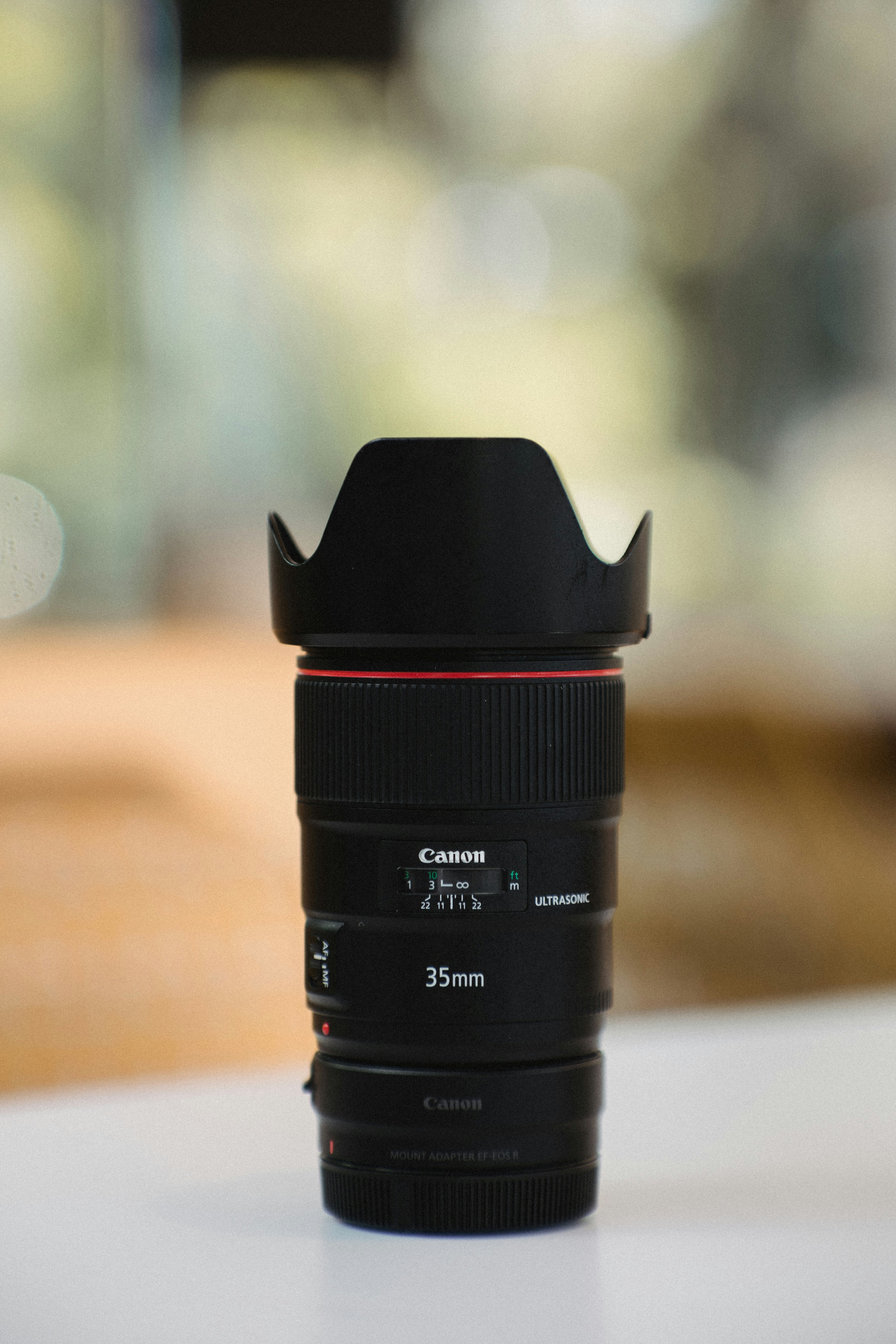 A camera lens sitting on top of a table photo – Free Electronics Image ...