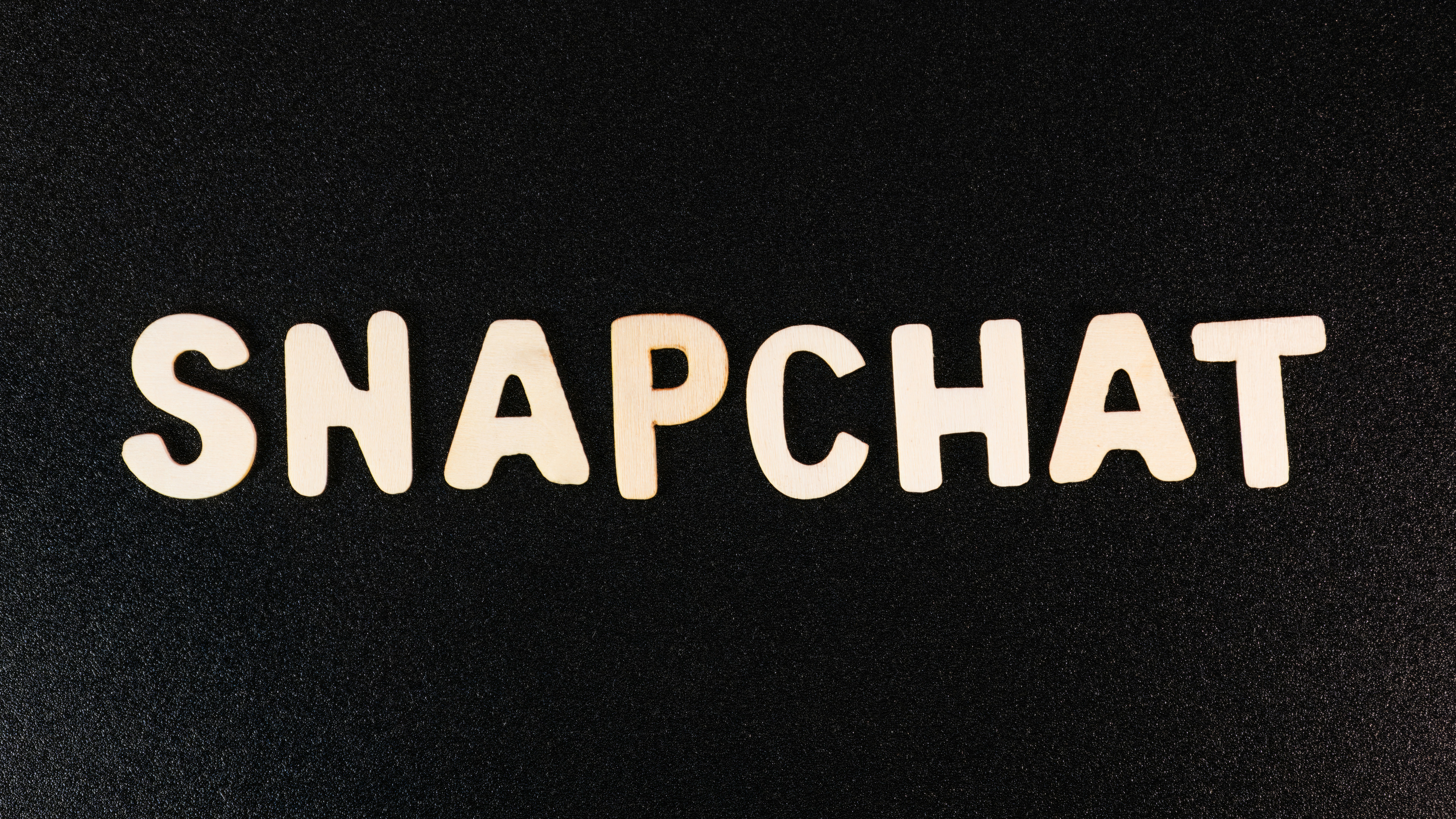 The word snapchat written in white type on a black background photo ...