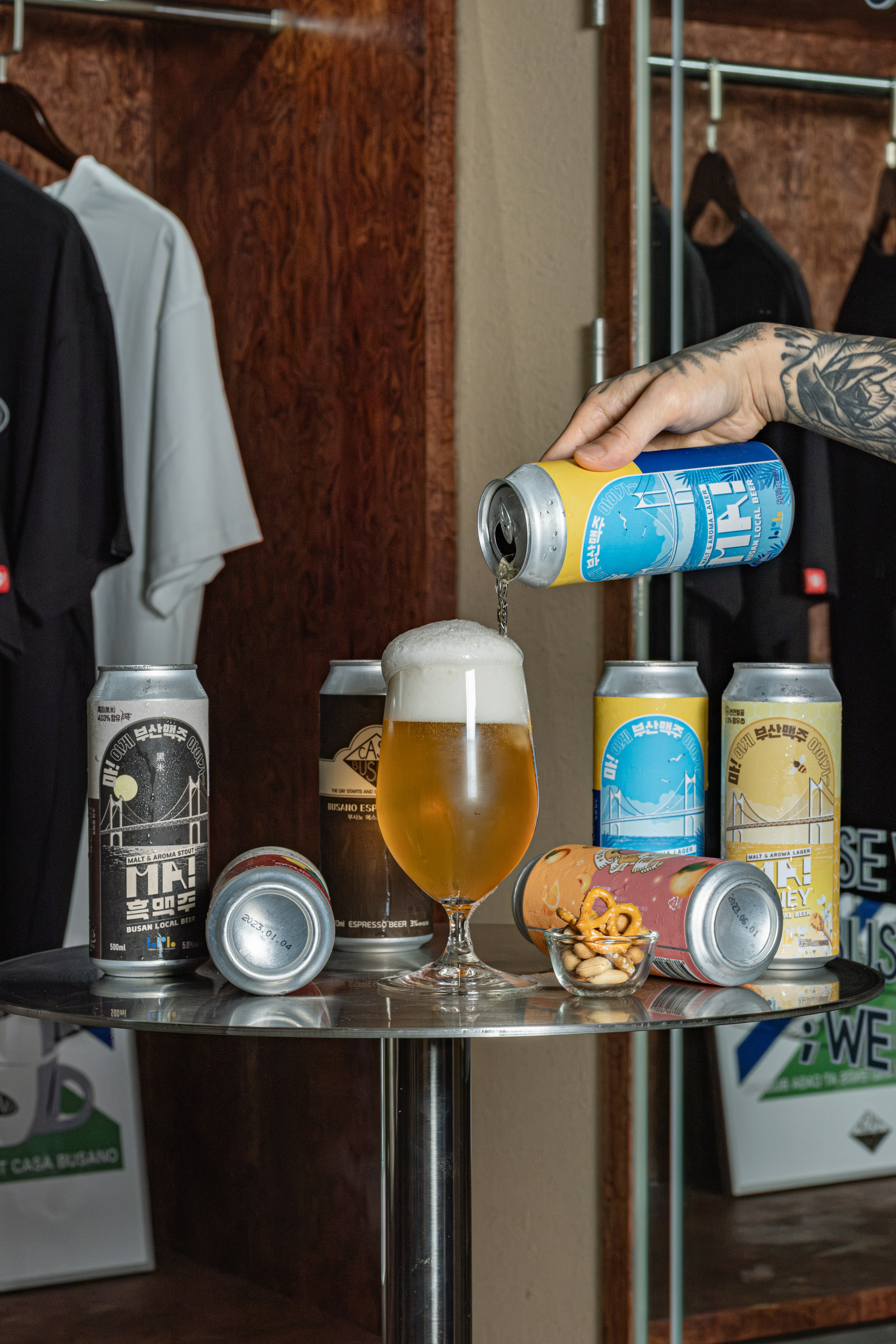 Pouring Craft: A Chill Moment Among cans and a glass of beer