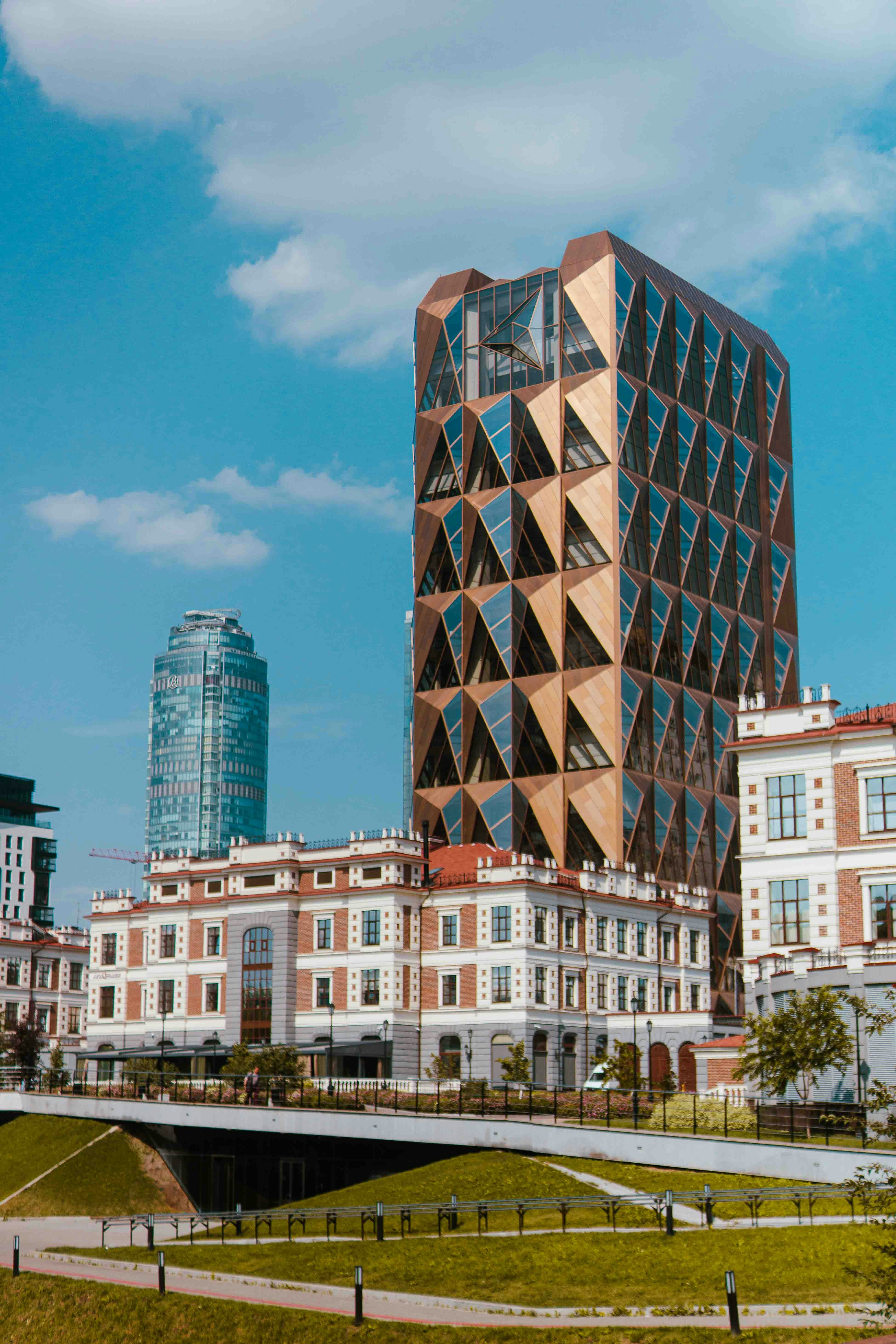 A tall building with a triangular design on top of it photo – Free ...