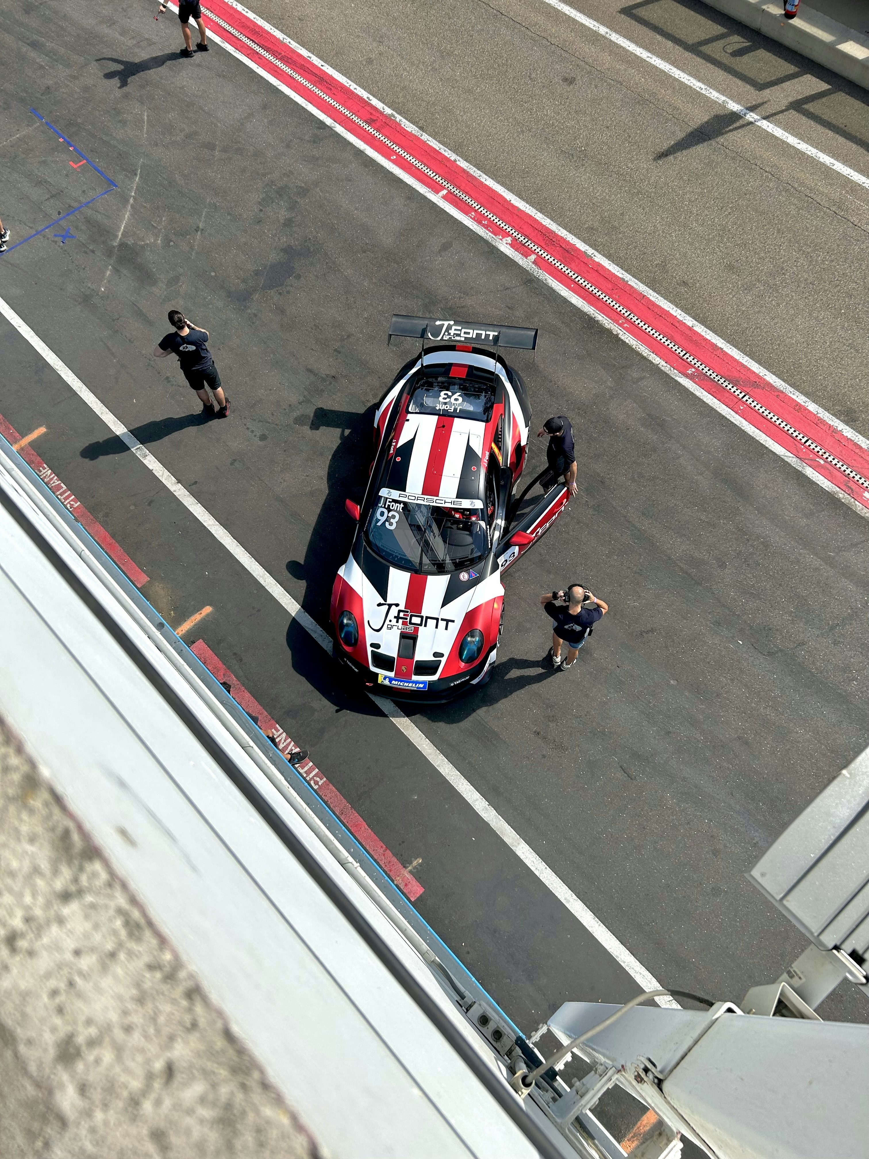 A race car parked on the side of a race track photo – Free Circuit ...