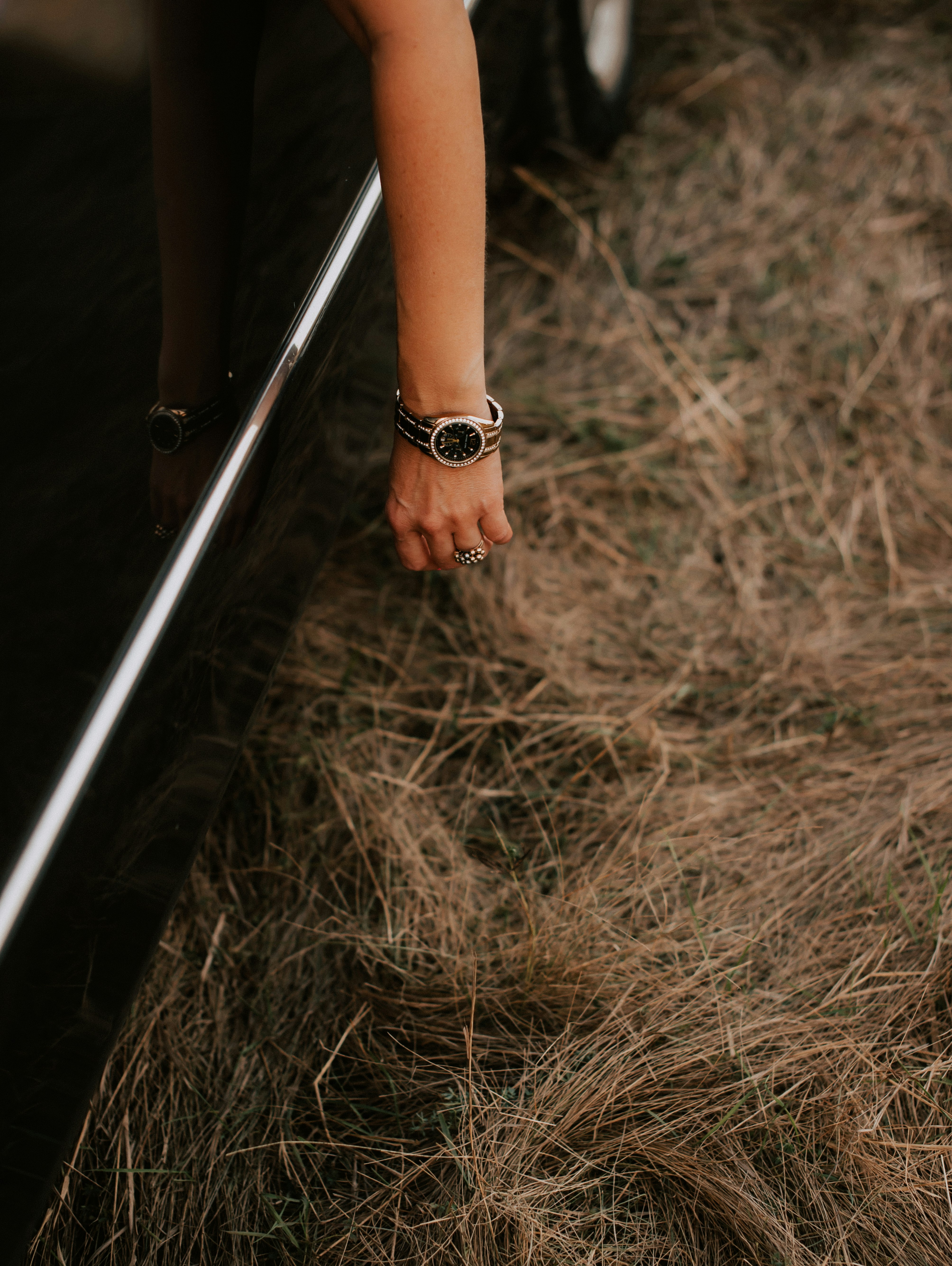 Time at the Car Door: A Close-Up of a Silver Watch