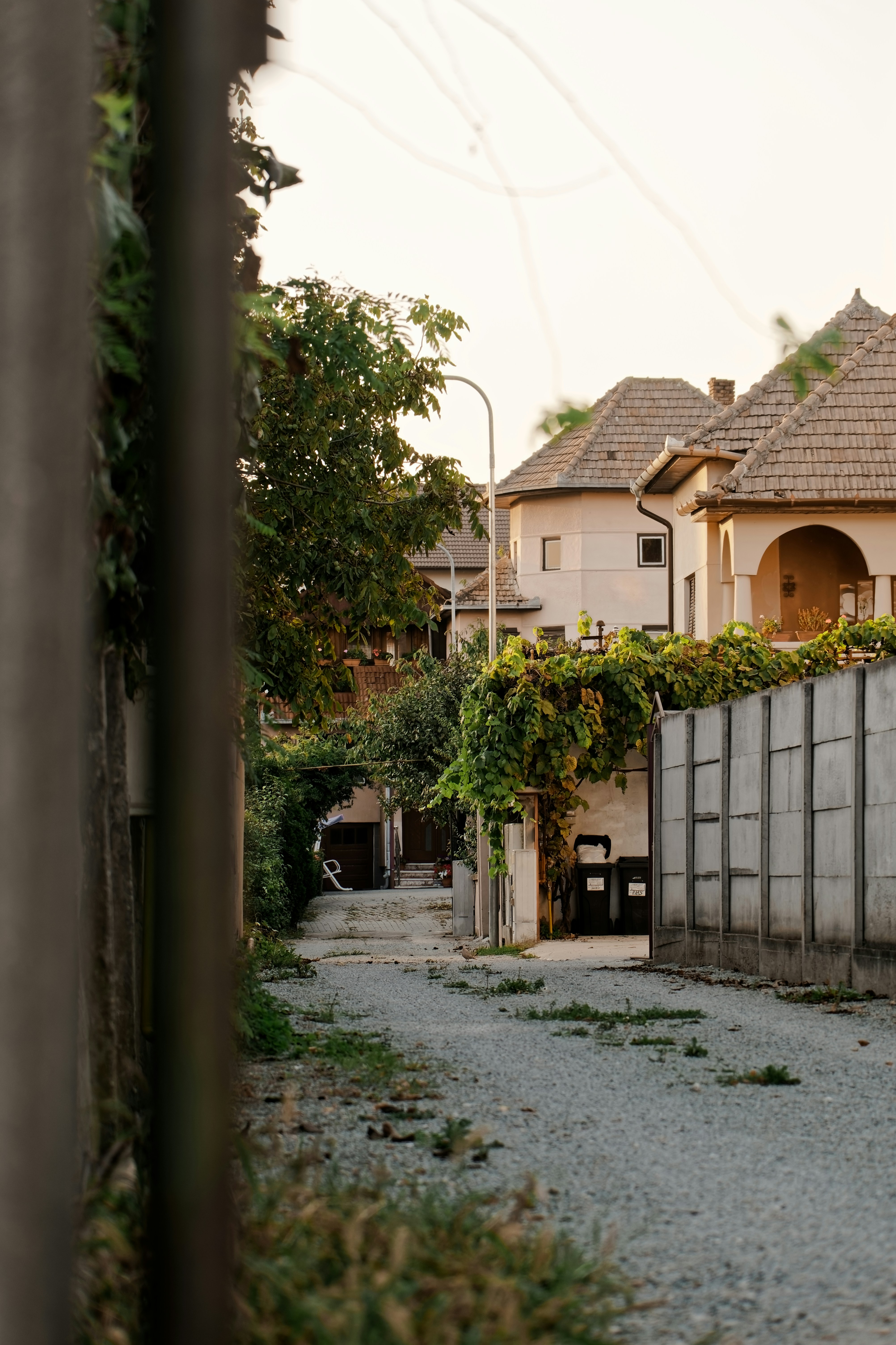 End of the Alley: A Gatehouse Bathed in Warm Evening Light