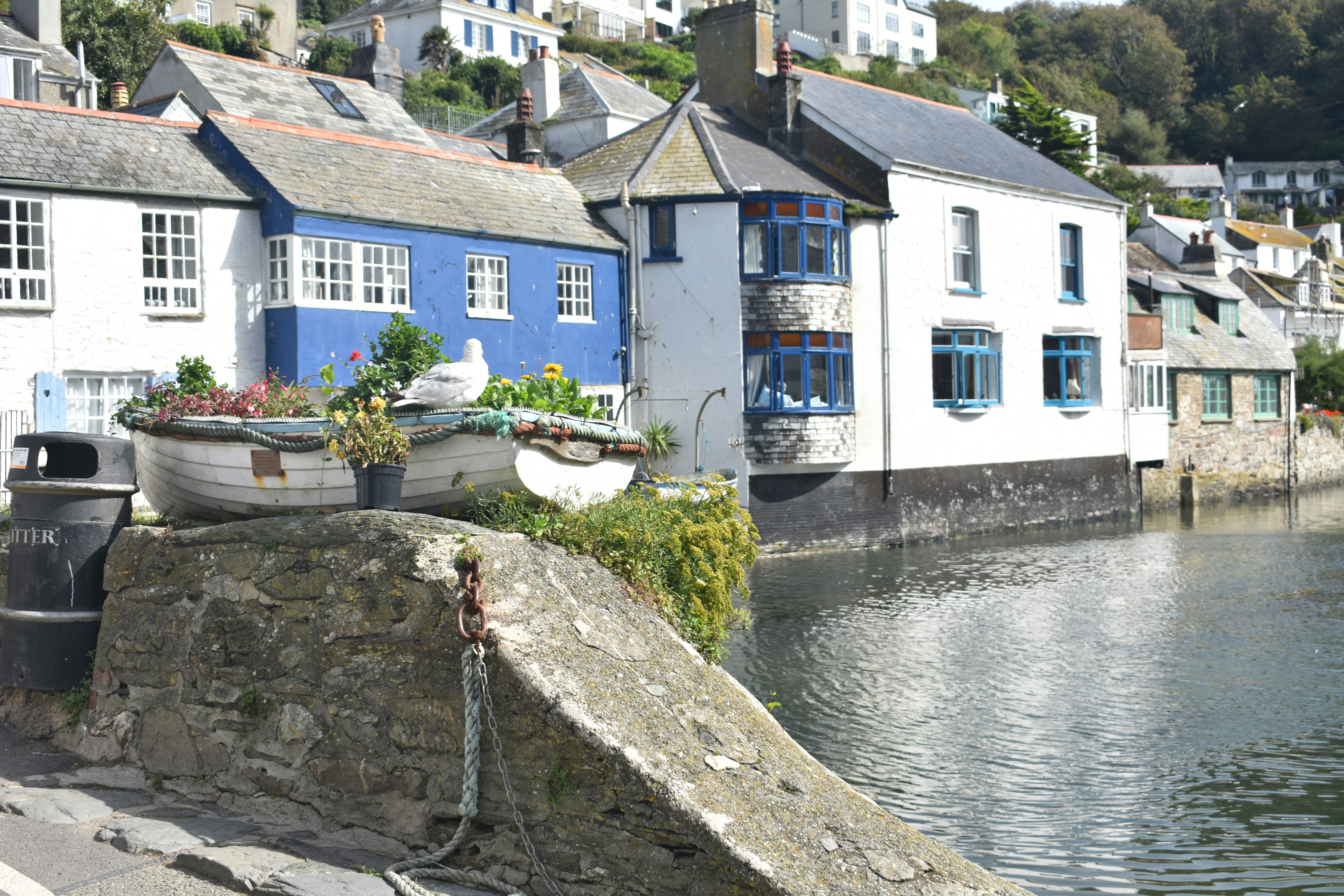 A row of houses next to a body of water photo – Free Polperro Image on ...