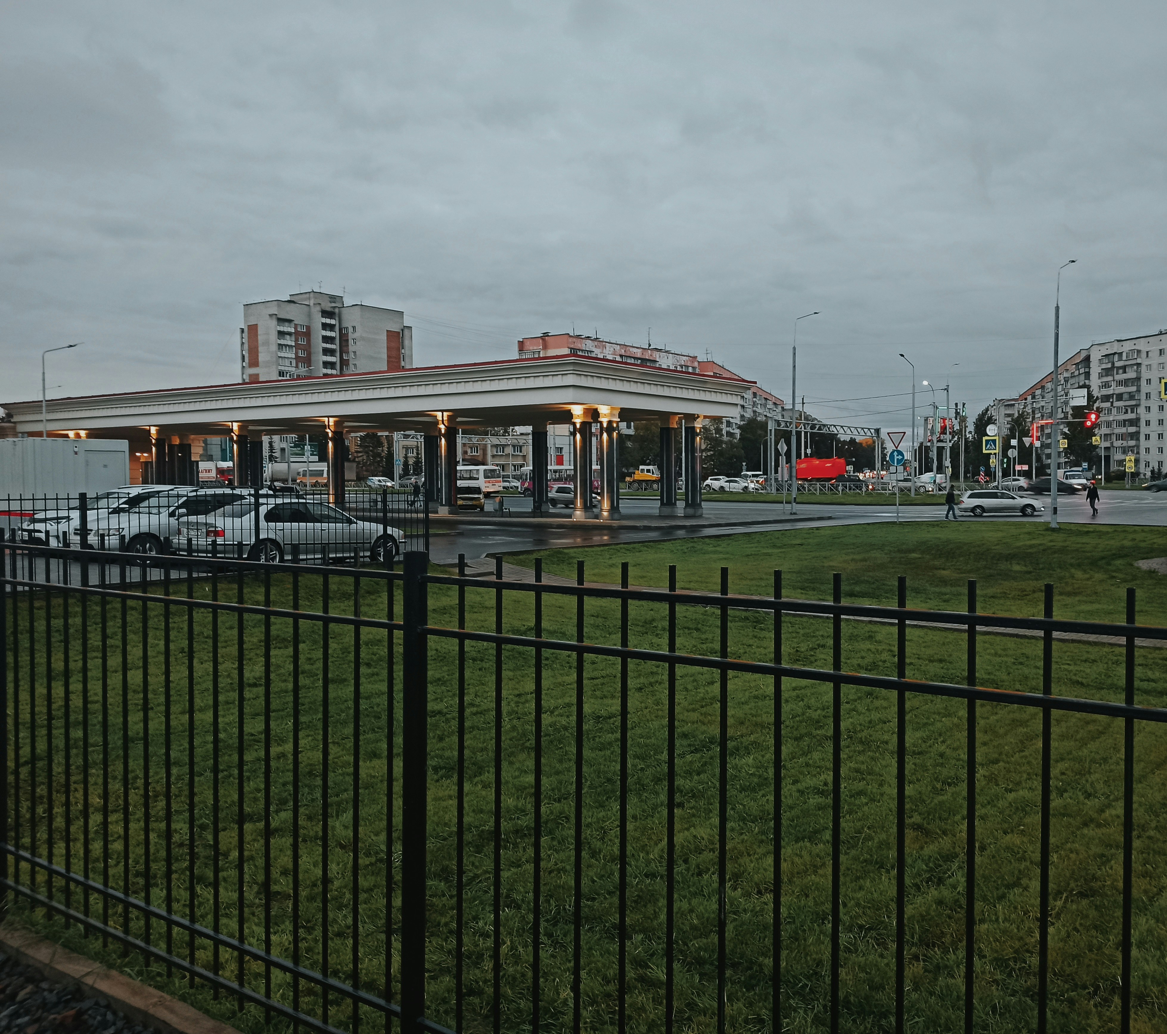 Railway station parking and city buildings on the background