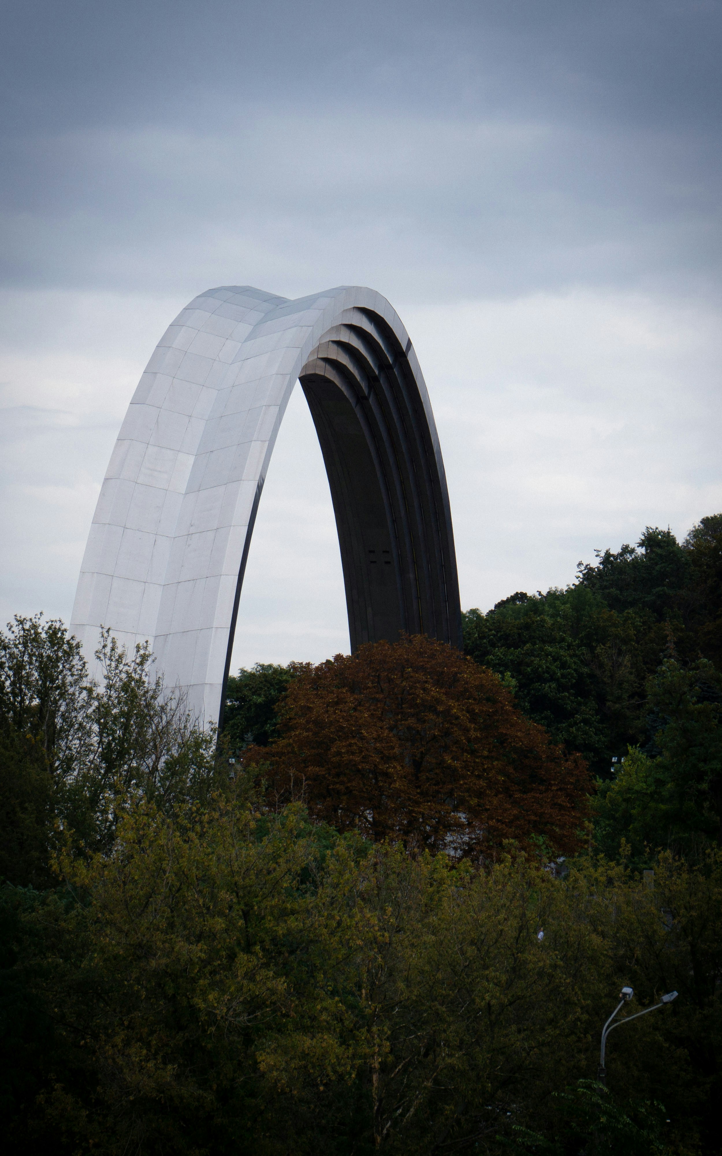 A large arch in the middle of a forest photo – Free Ukraine Image on ...