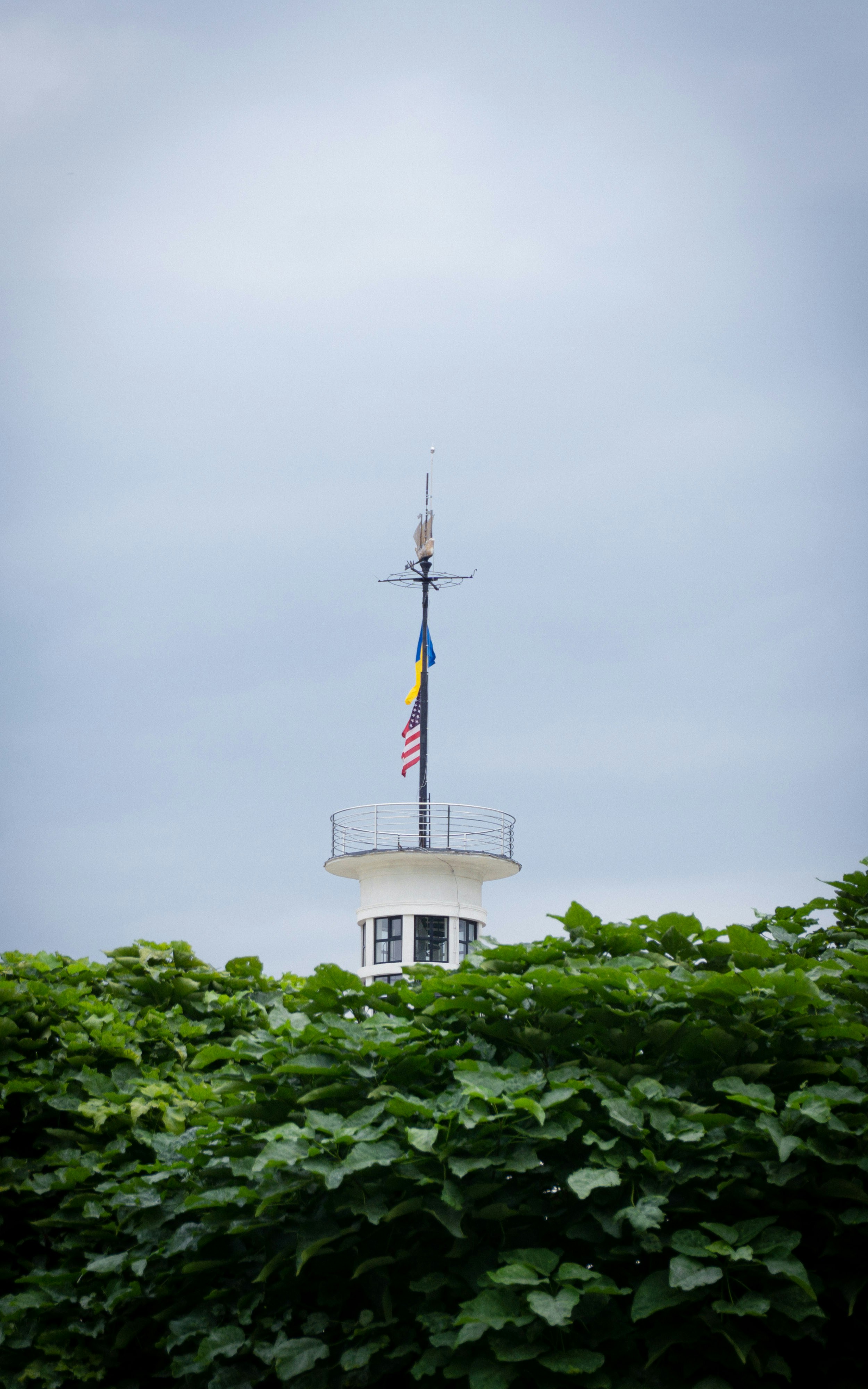 A tall tower with a flag on top of it photo – Free Ukraine Image on ...