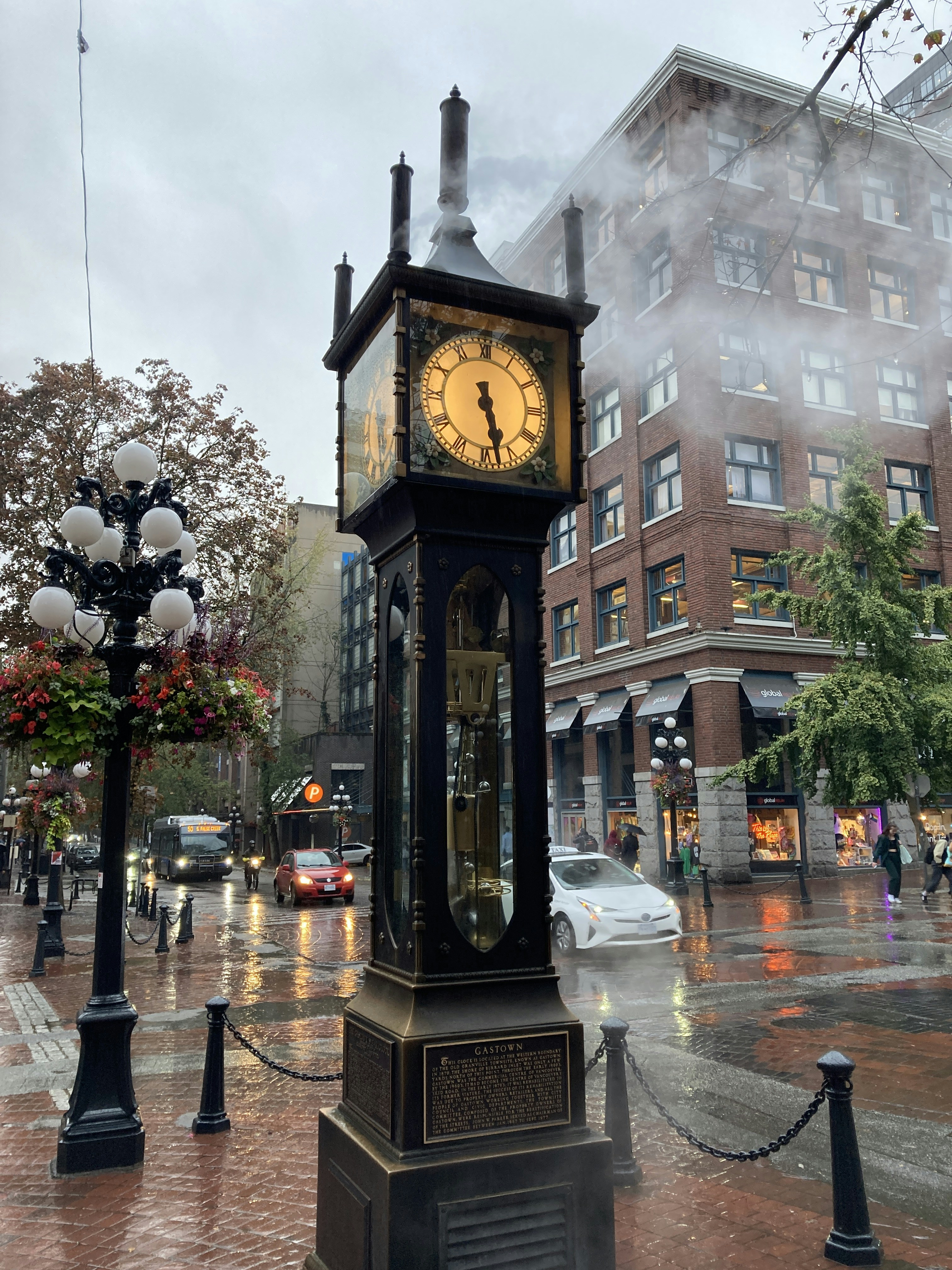 A clock tower on a city street in the rain photo – Free Gastown steam ...