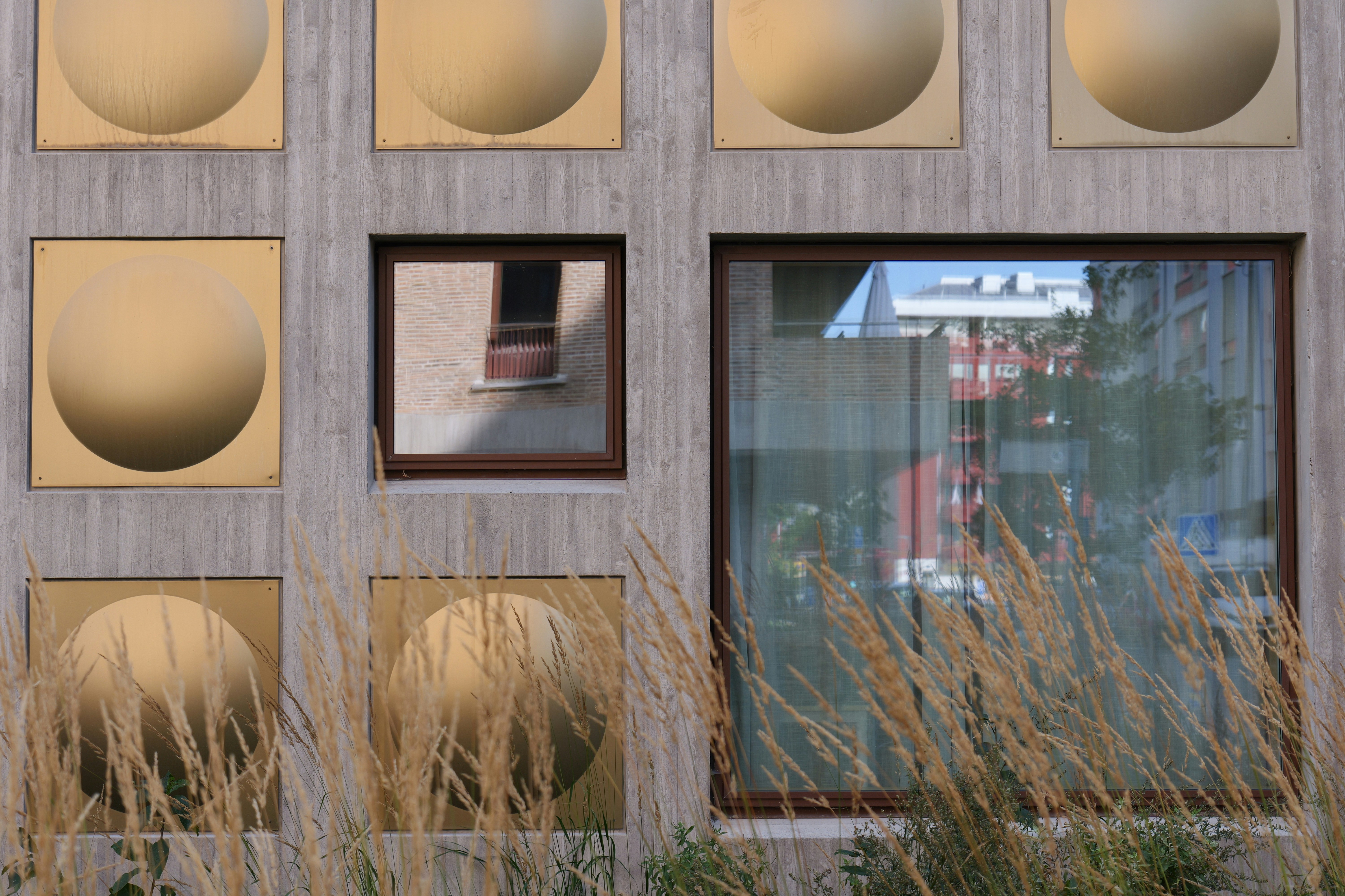 Amber Orbs and Glass in a Concrete Grid: Facade Study