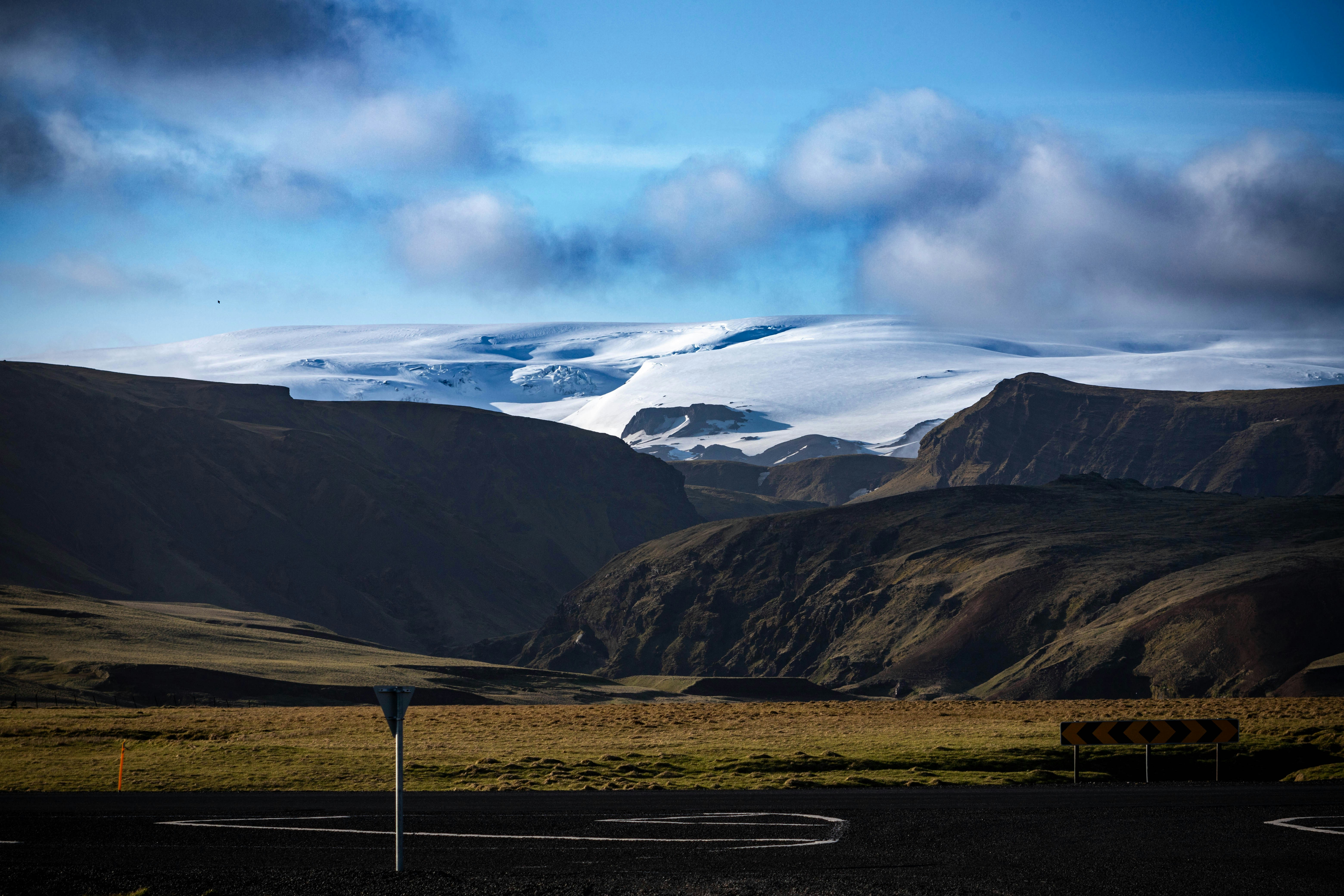 Snowcap Echoes over a Rugged Icelandic Plateau
