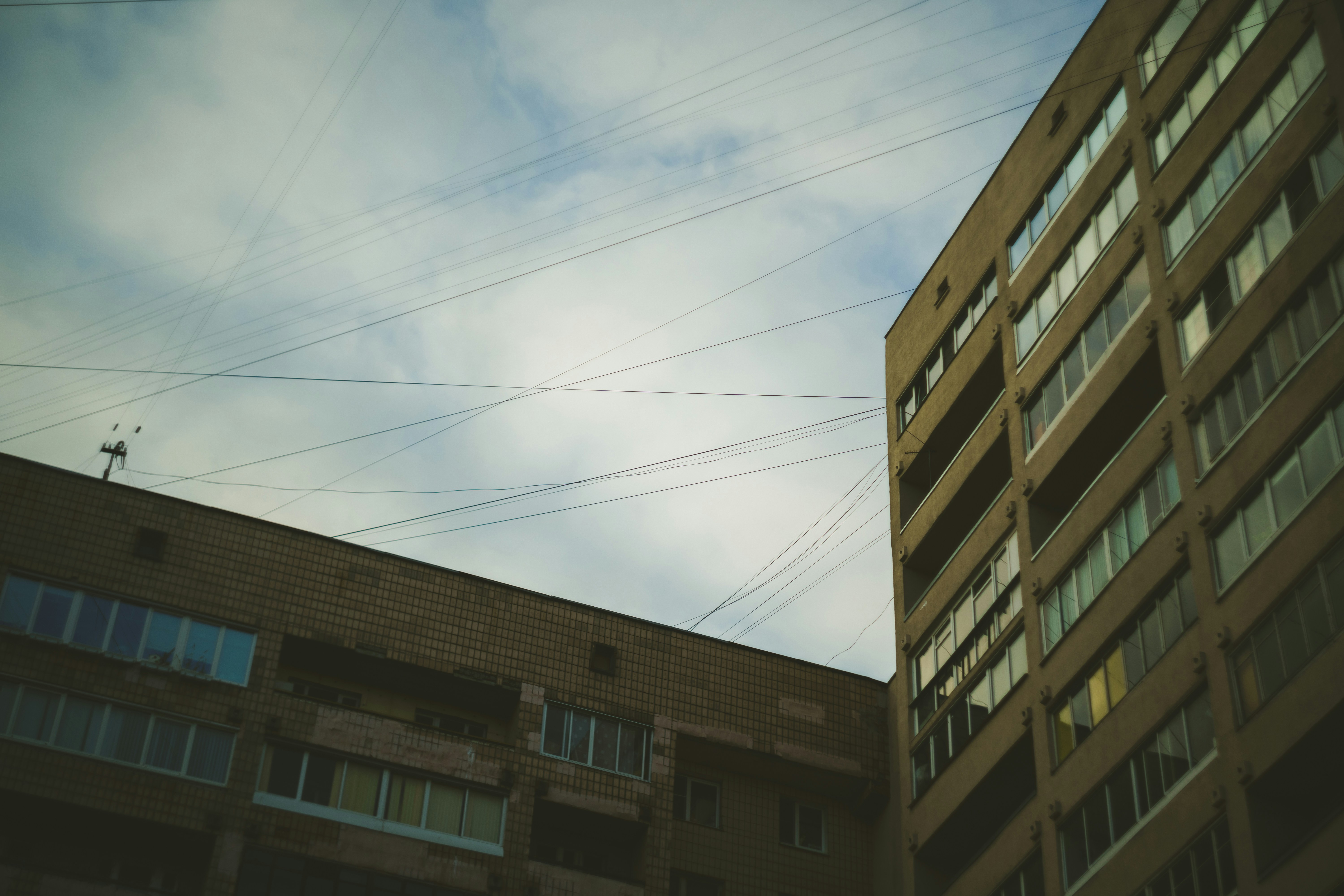 Wired Skyline Above Parallel Brick Facades