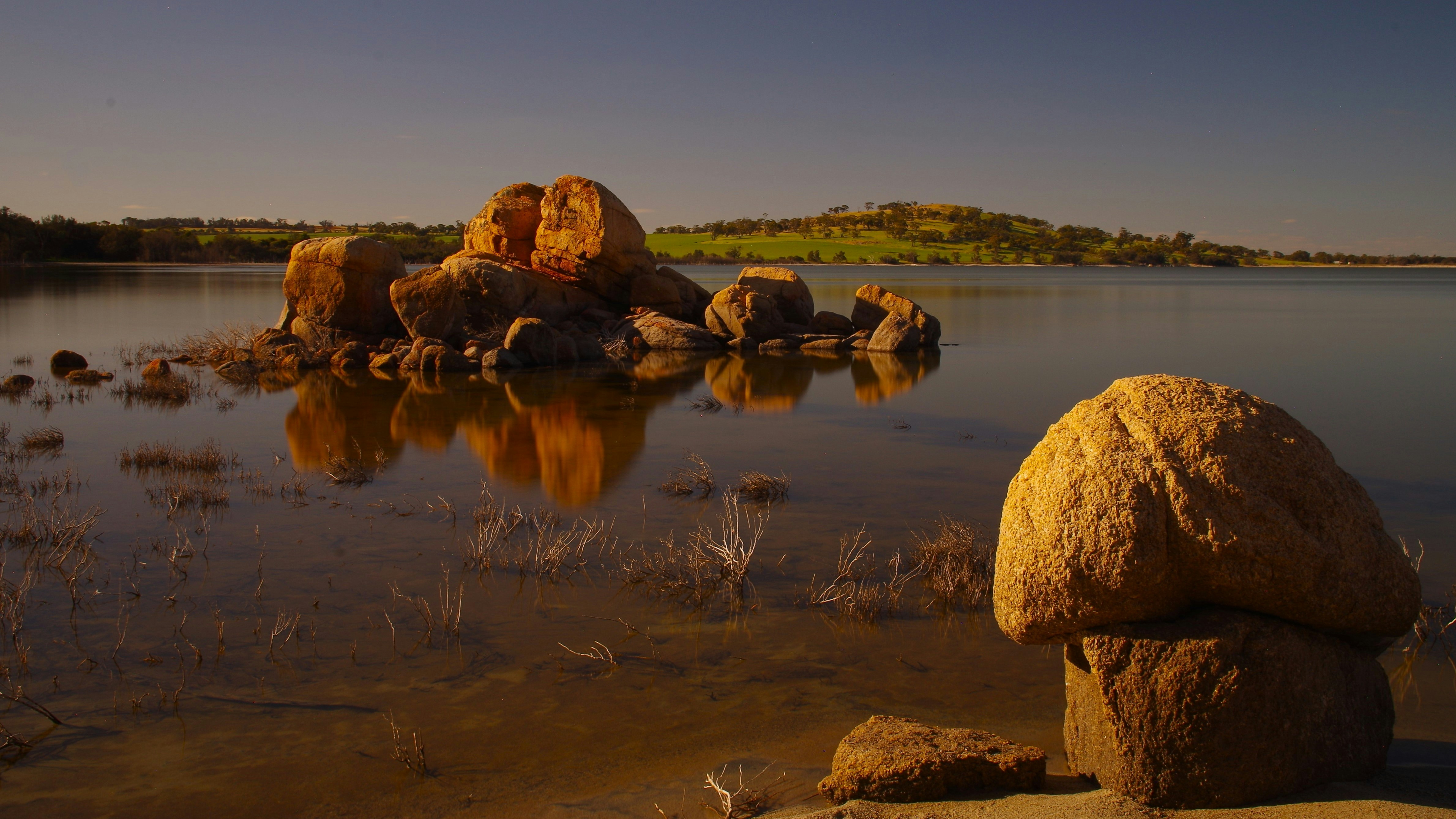 A large rock sitting on top of a body of water photo – Free Norring ...