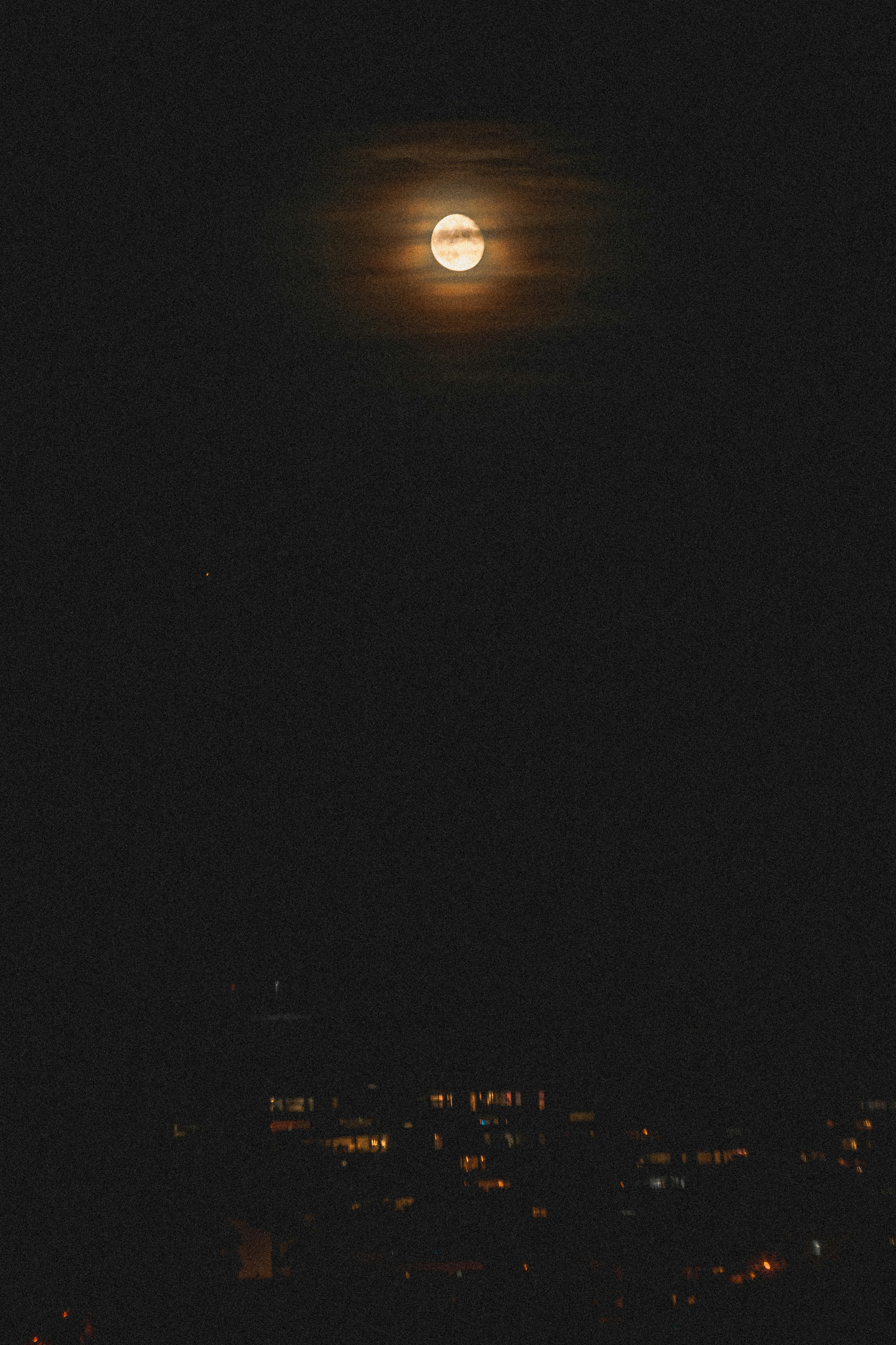 Moonrise Over a Sleeping City Skyline