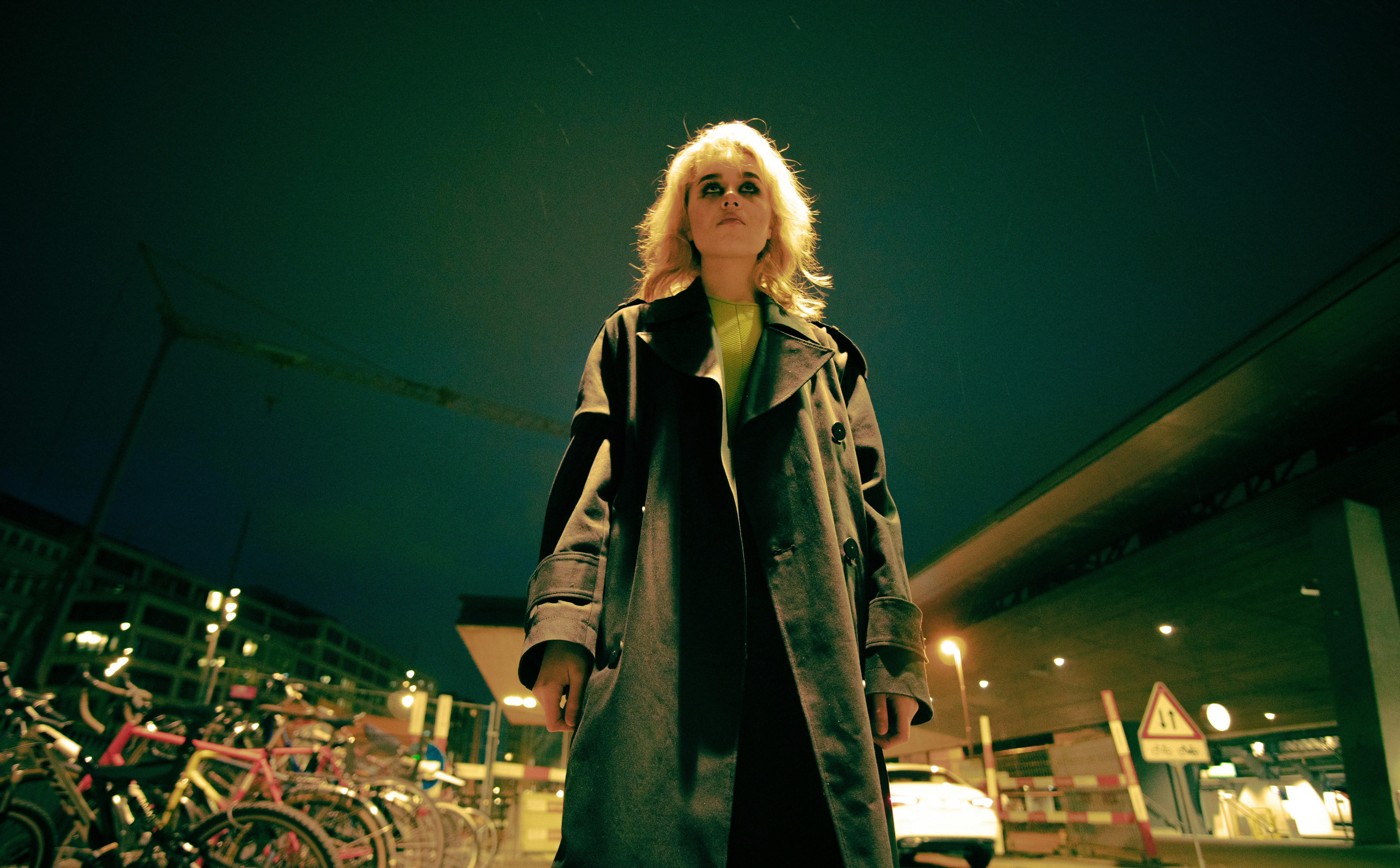 Neon Underpass: A Low-Angle Night Portrait Beneath the Urban Canopy