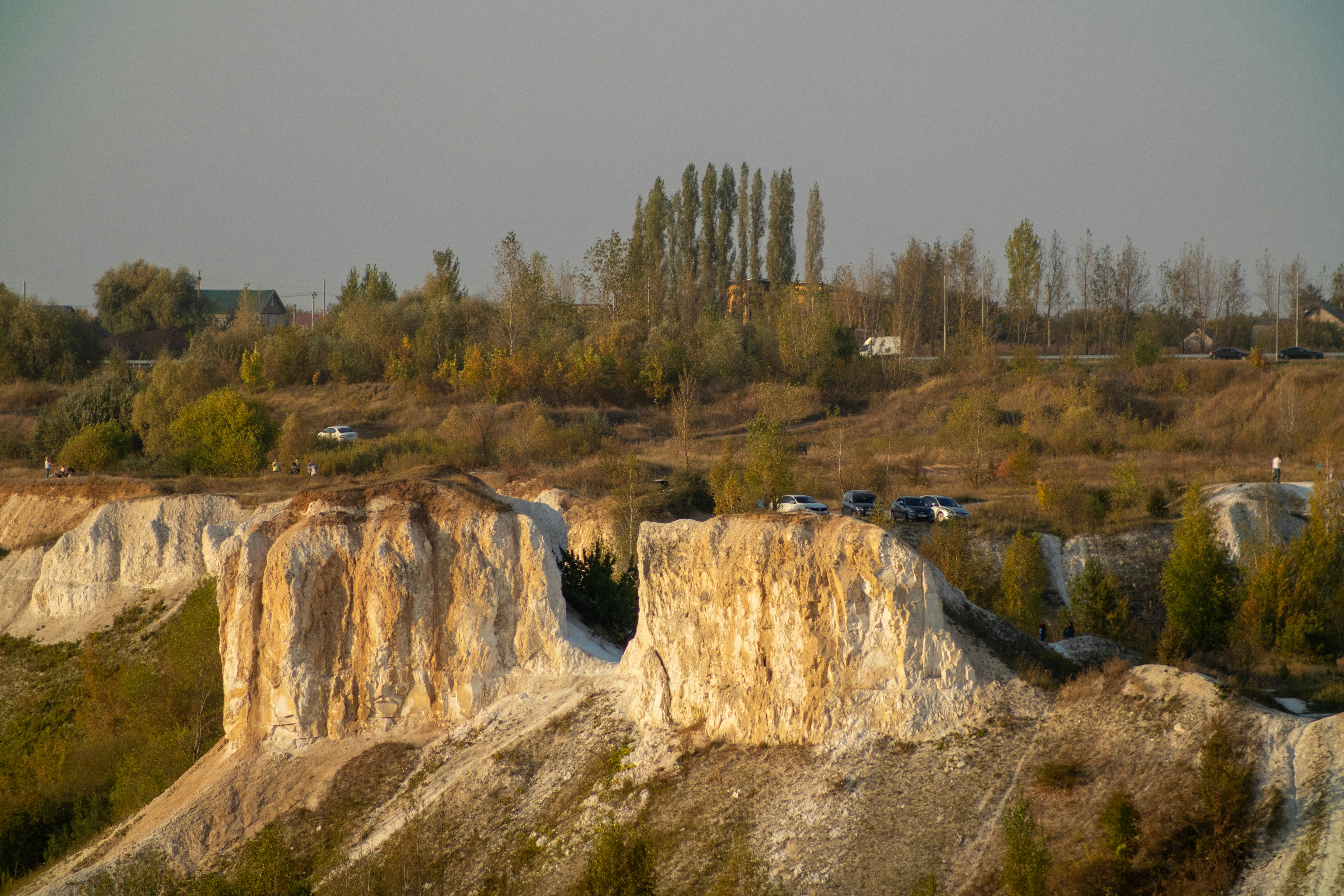 Chalk Cliffscape at Dusk: Vehicles on a Quiet Ridge