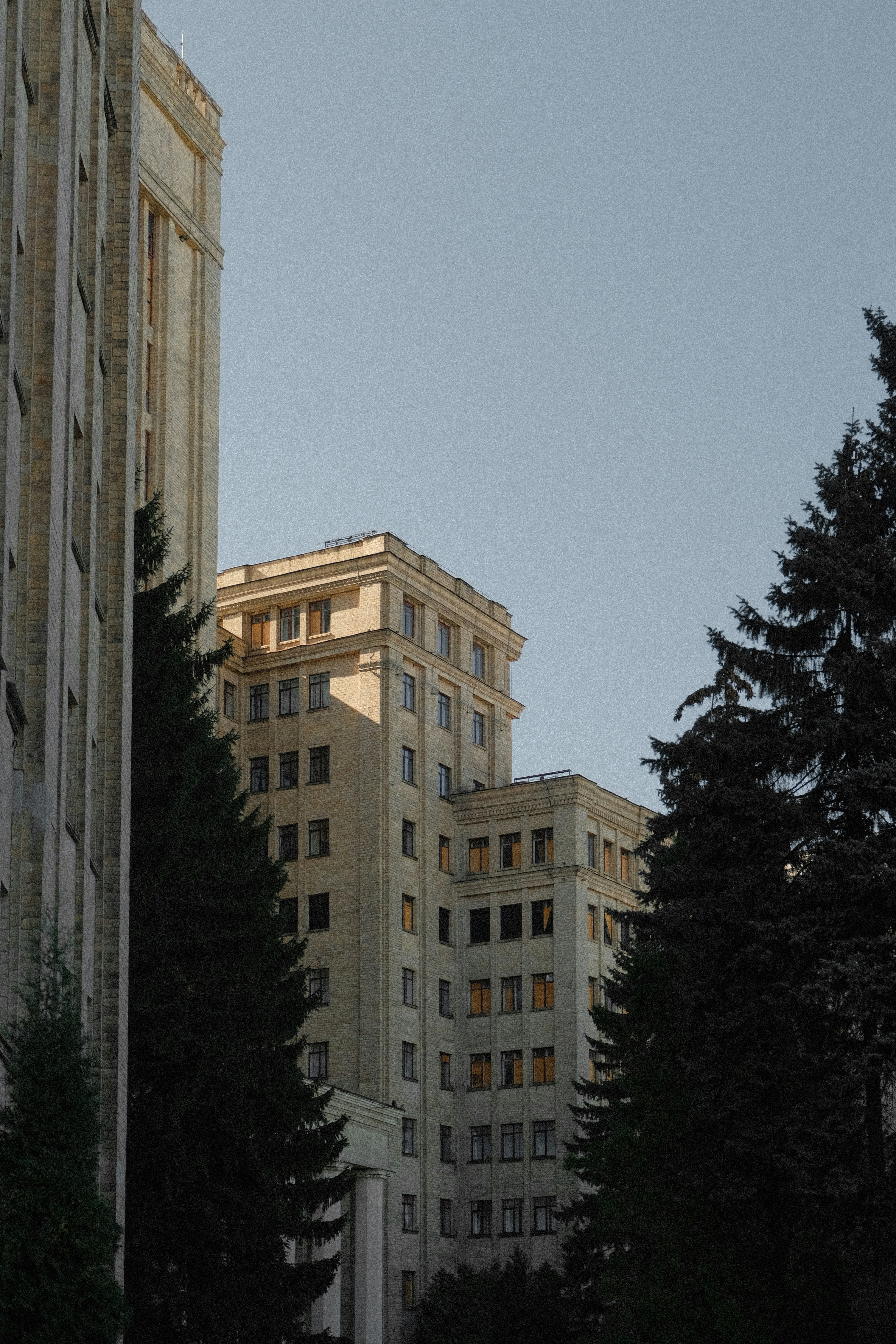 A tall building with a clock on the front of it photo – Free Kharkiv ...