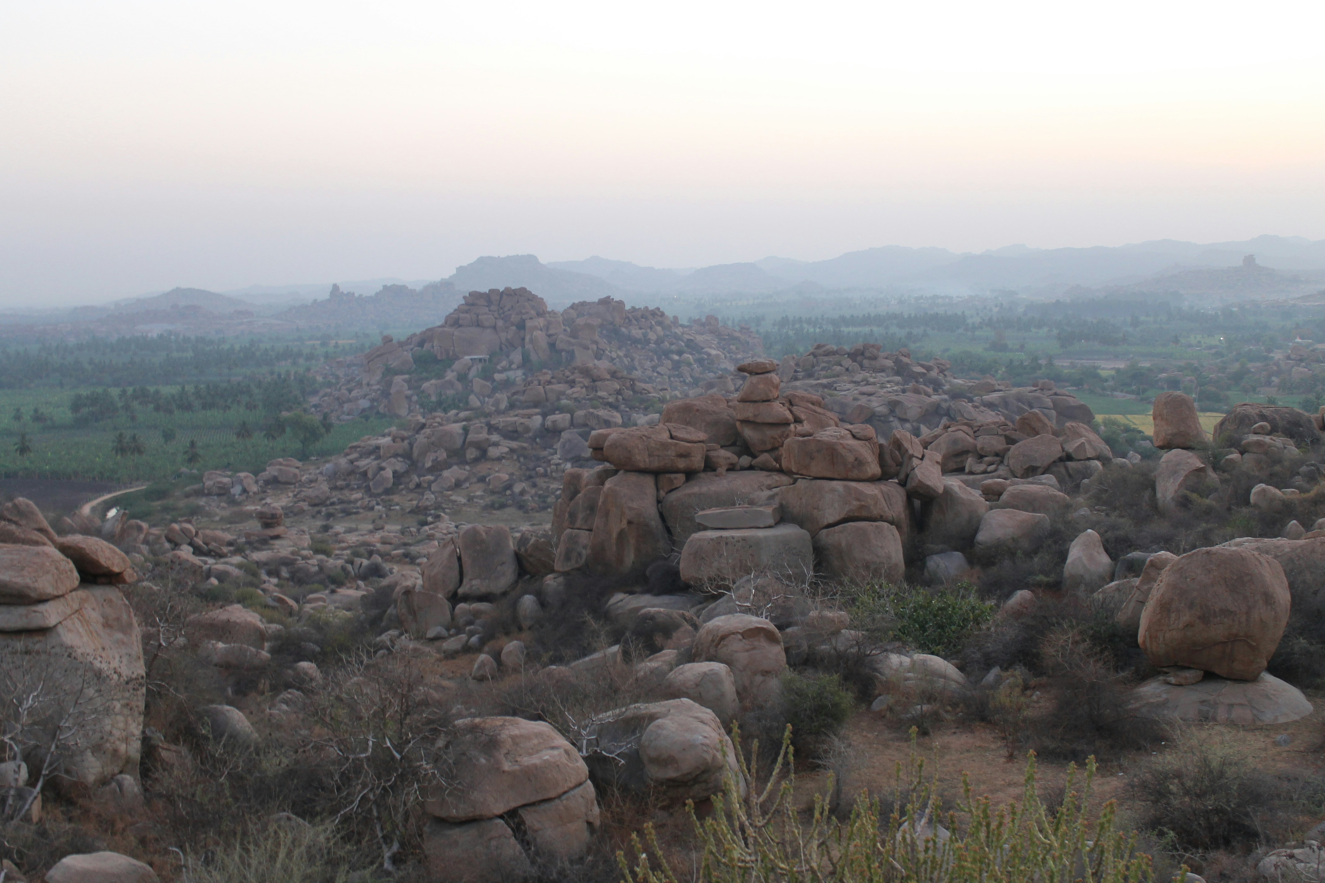 Horizon of Granite: Pebble Towers Beneath a Soft Dawn Sky