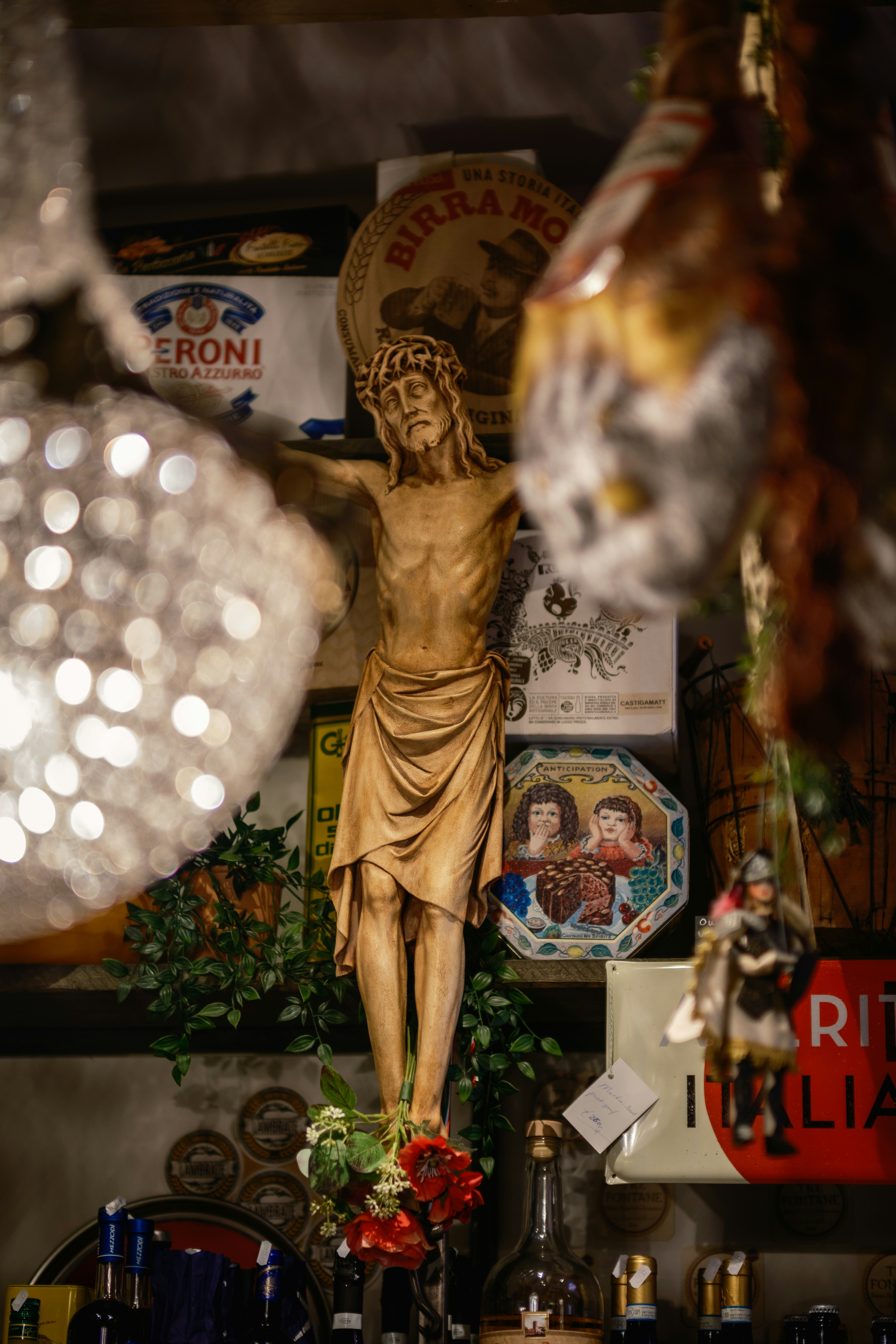 a wooden statue of jesus on a table