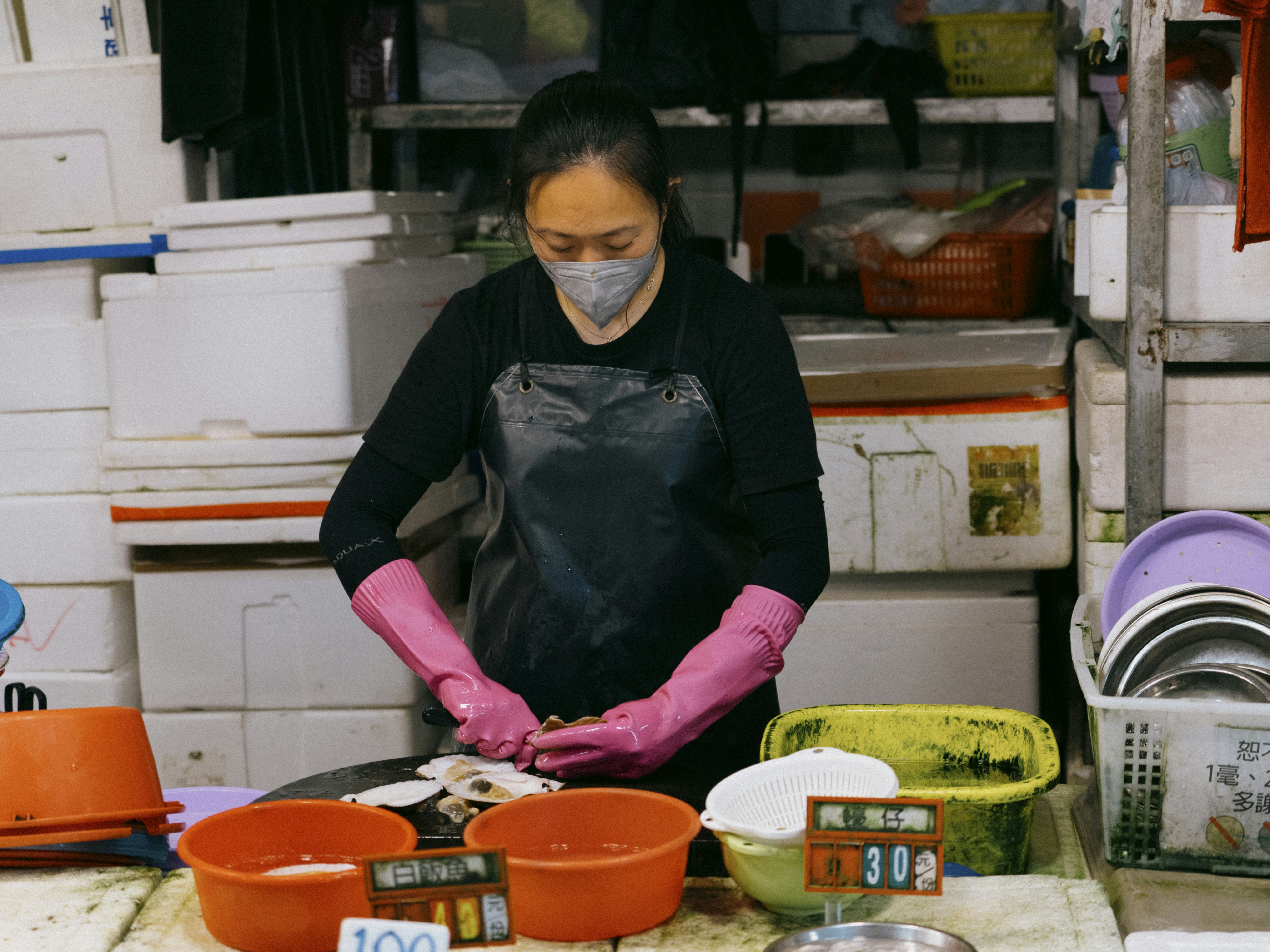 A woman wearing a face mask and gloves in a kitchen photo – Free City ...