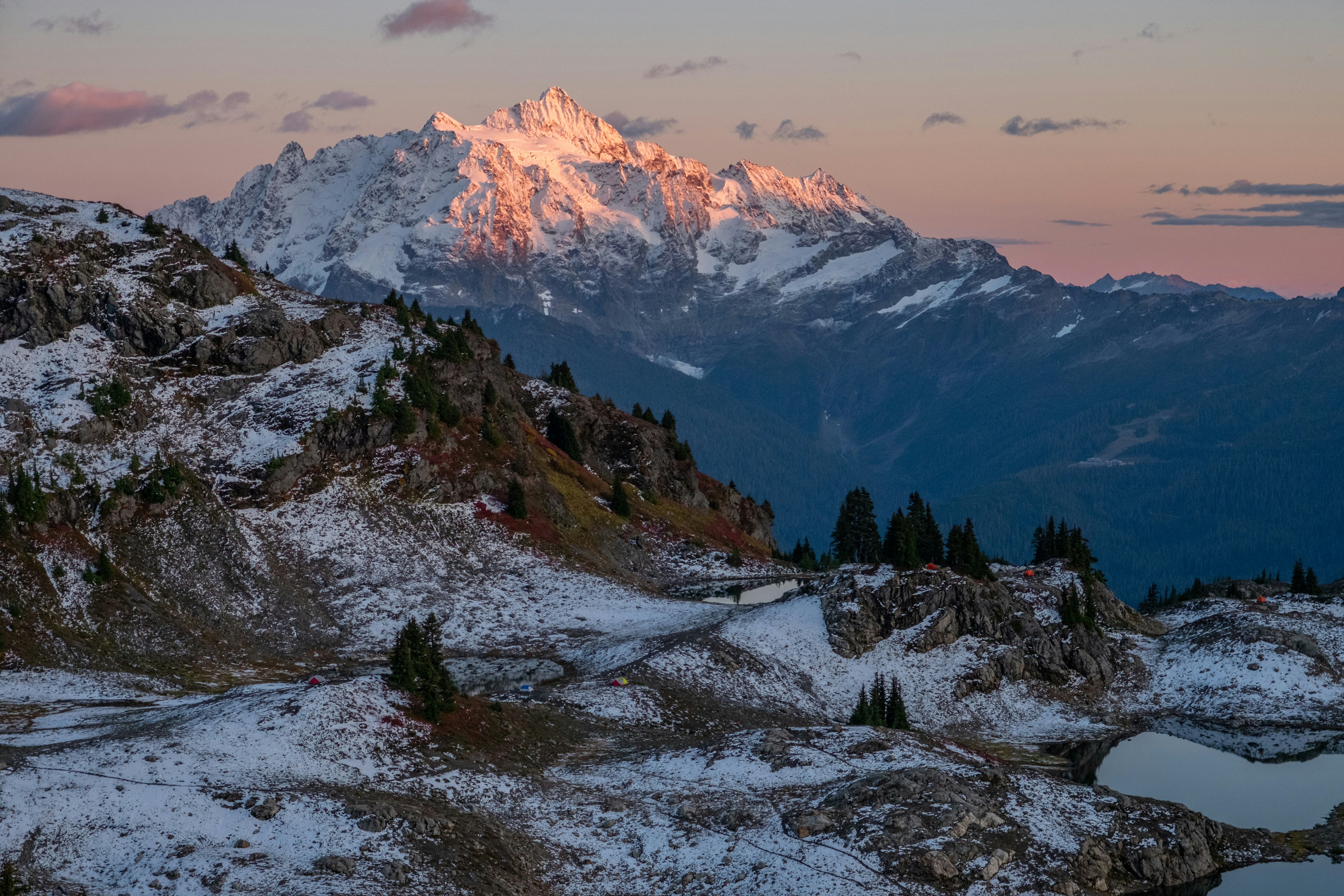 Crimson Crest Rising: Dusk on a Snow-Lit Summit