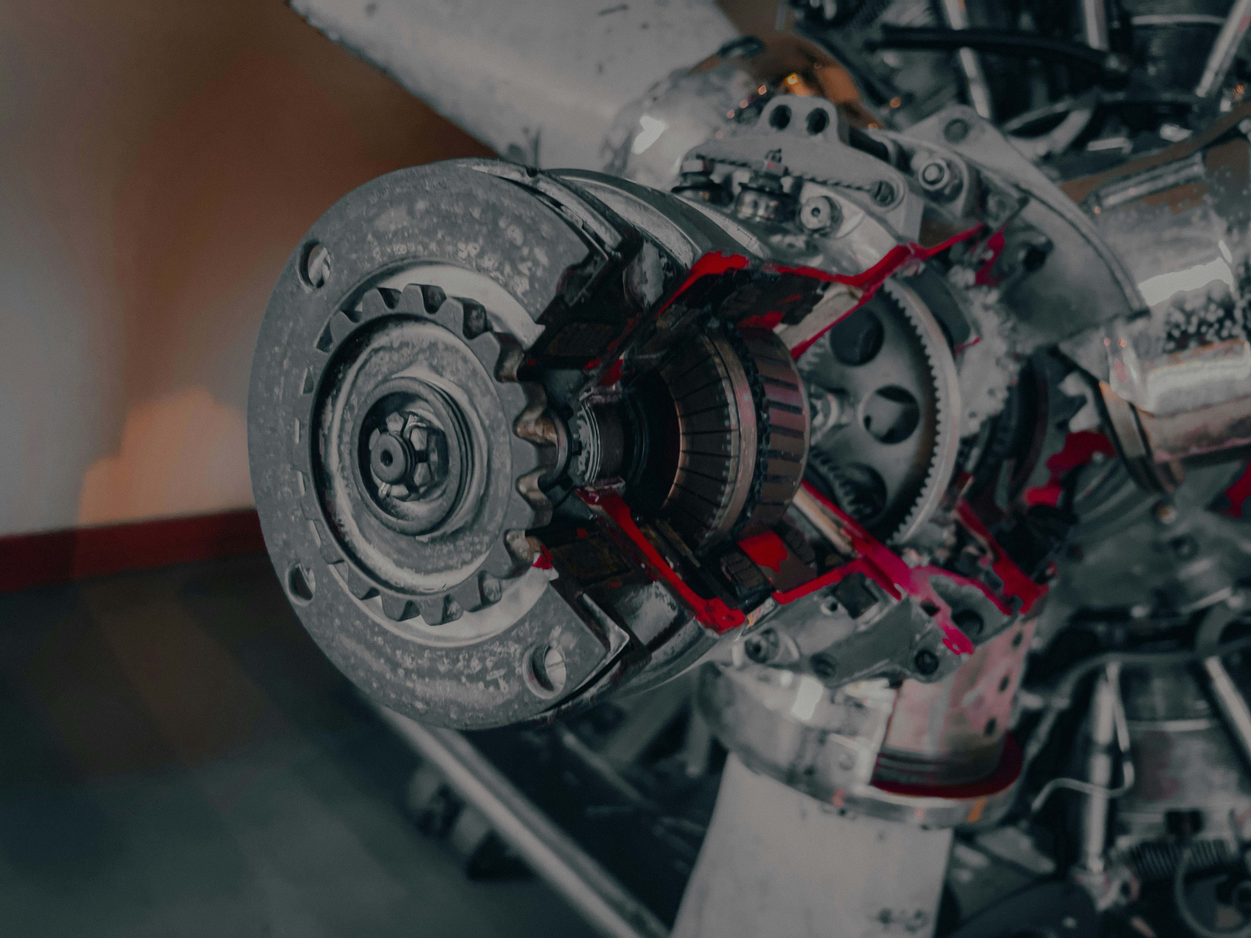 A close up of a jet engine with red paint on it photo – Free Machine ...
