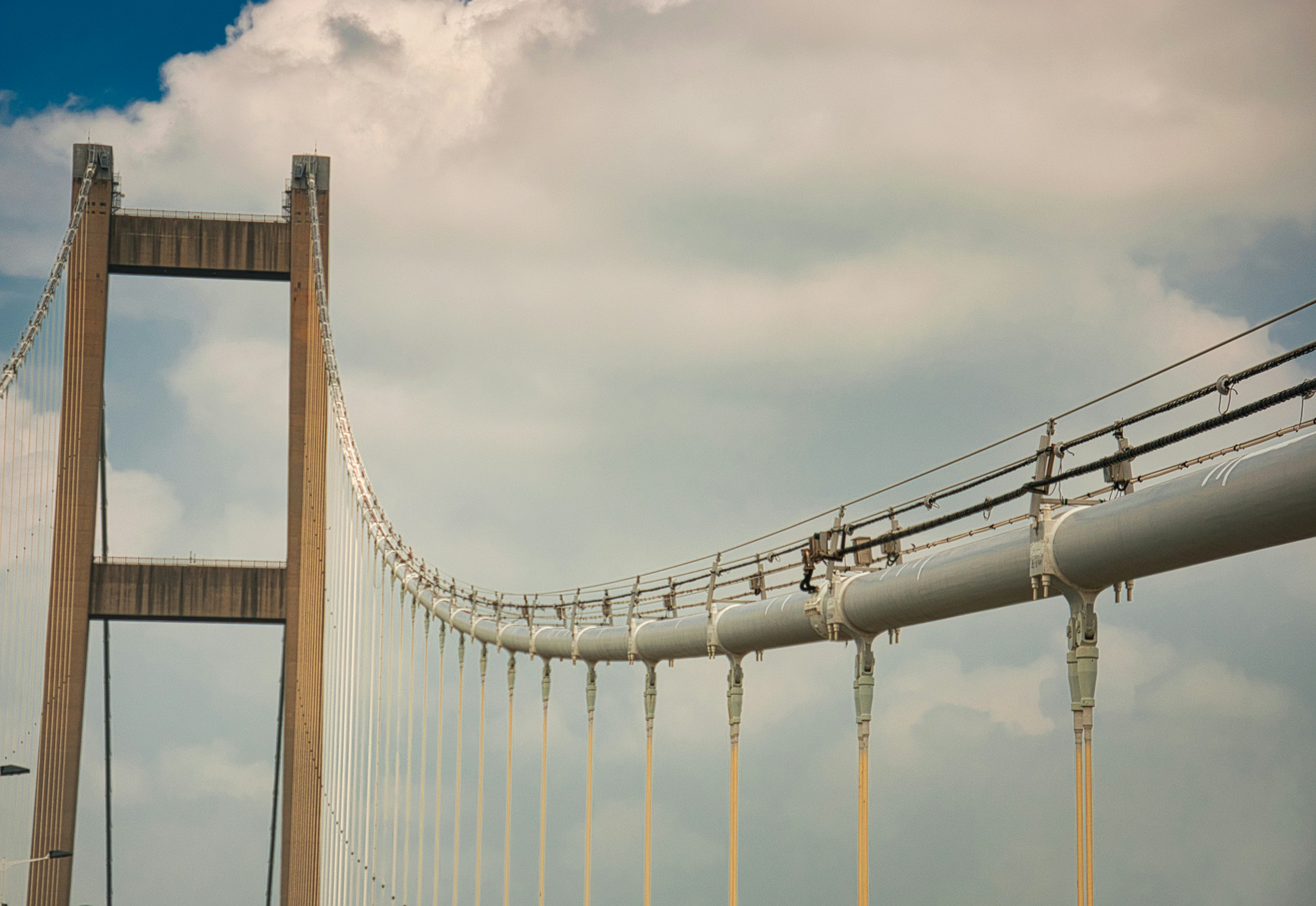 A very tall bridge with a traffic light on it's side photo – Free ...