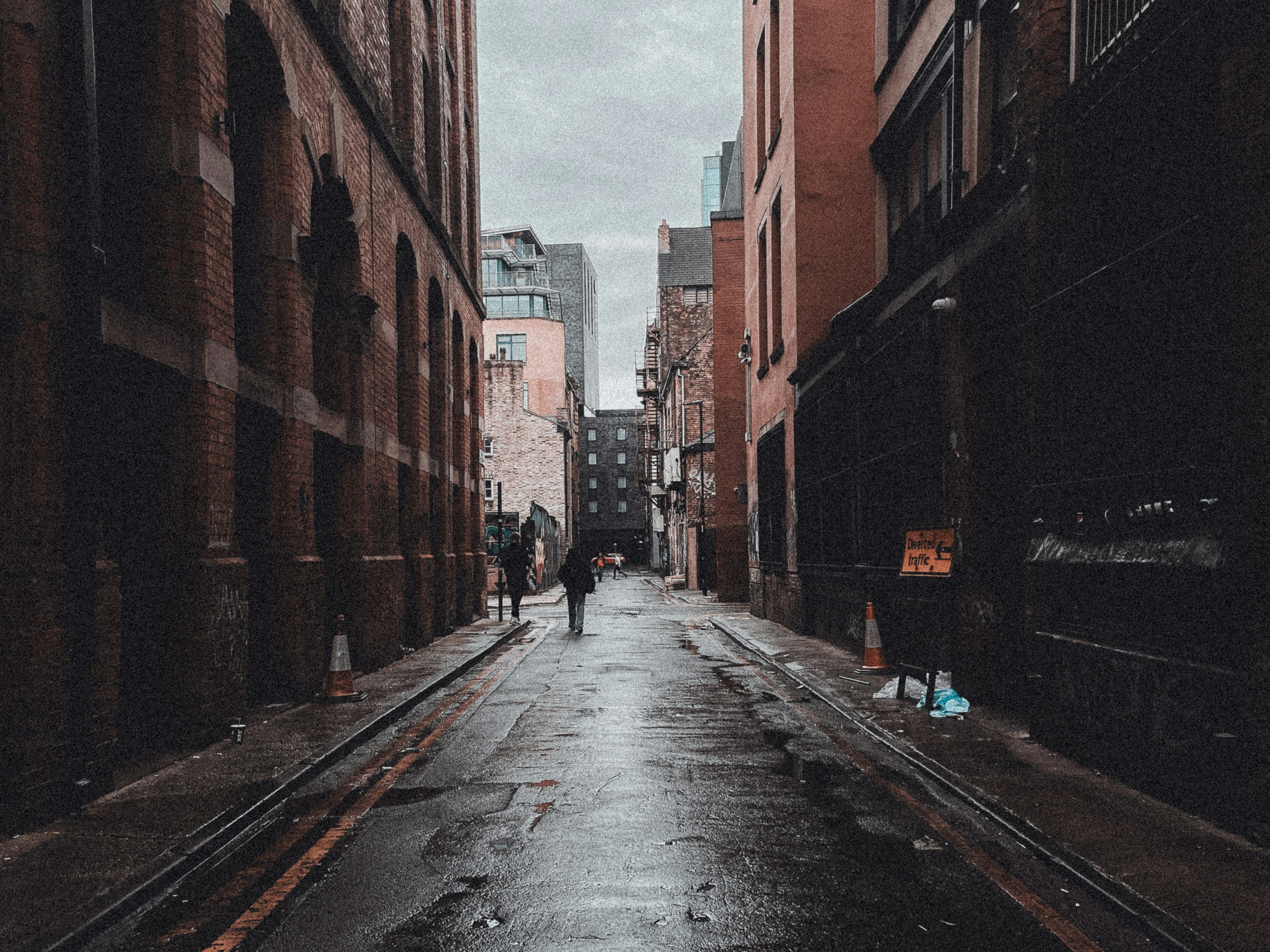 A person walking down a wet alley way photo – Free Wallpaper Image on ...