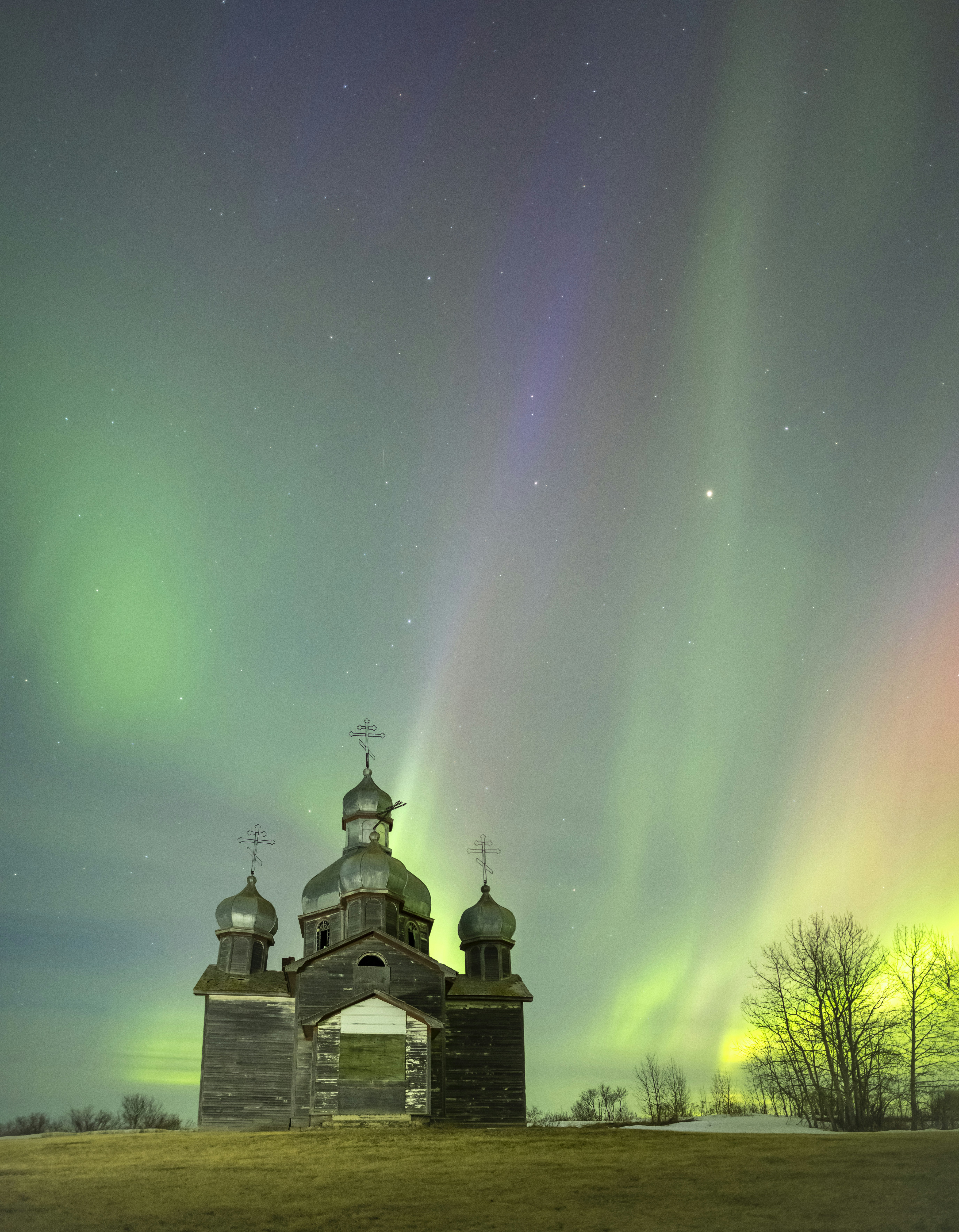 A church with a lot of lights in the sky photo – Free Night Image on ...