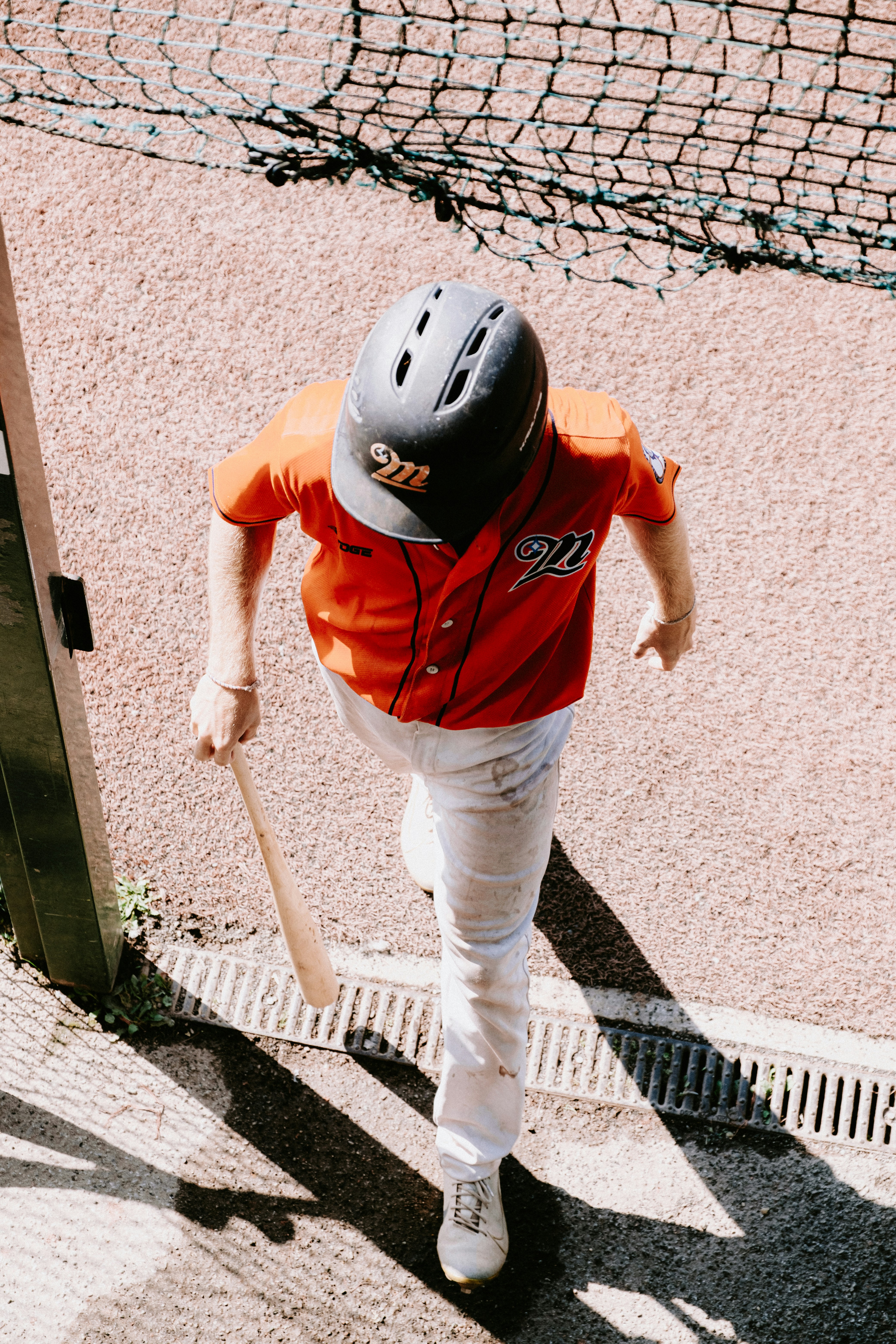 Bird's-Eye View: A Batter in Orange Approaches the Plate