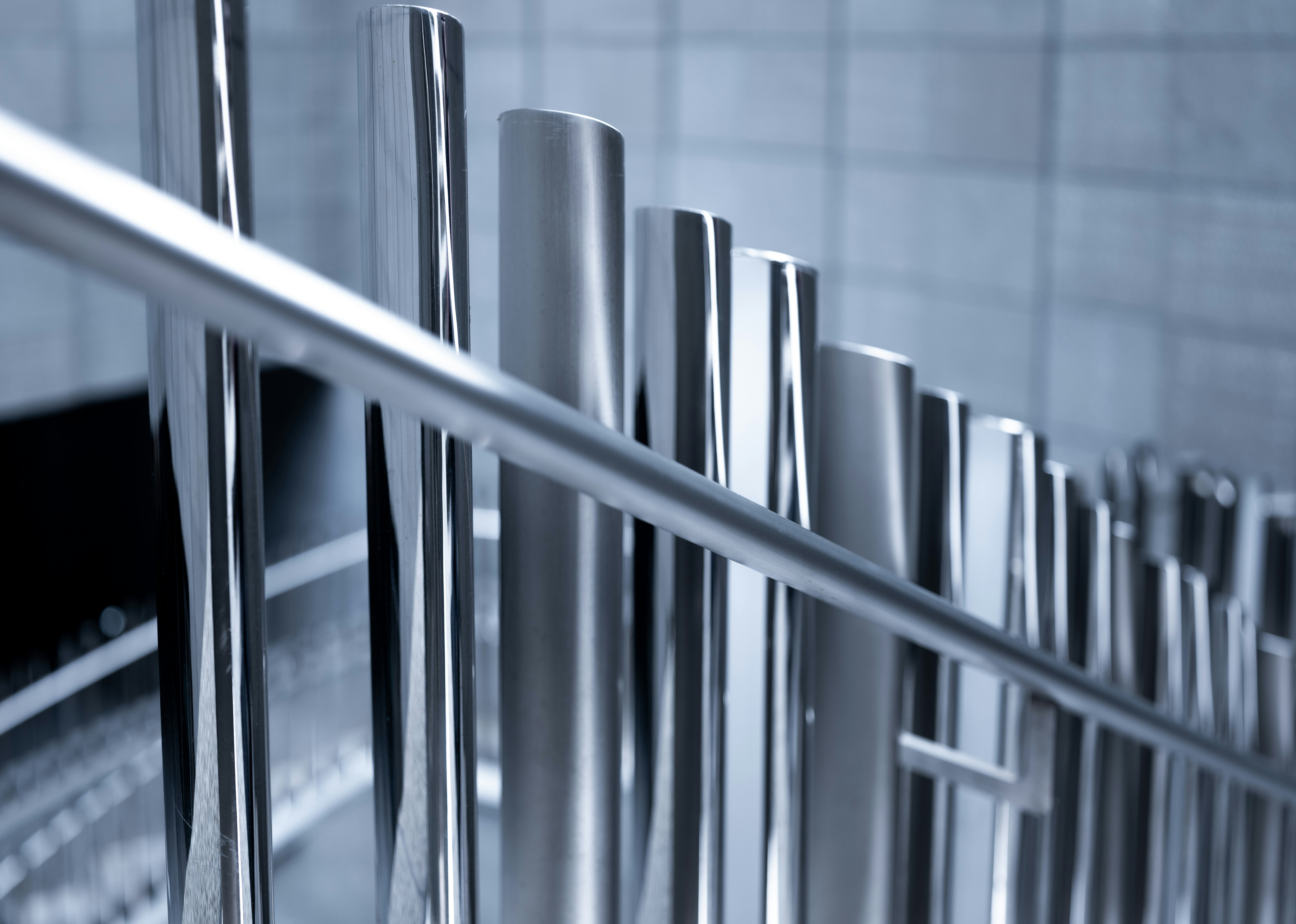 A bunch of stainless steel poles in a room photo – Free Texture Image ...
