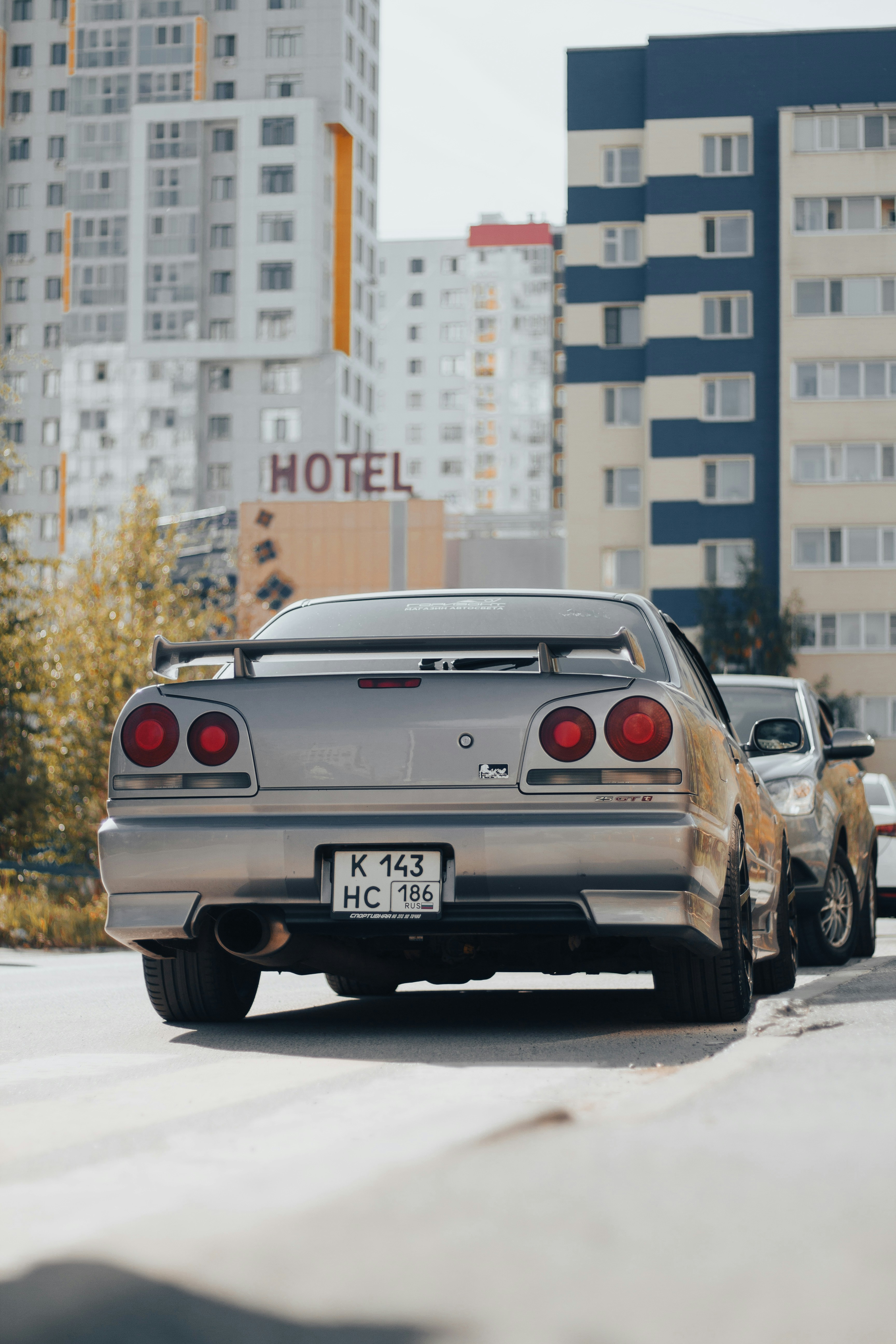 a silver car parked on the side of the road
