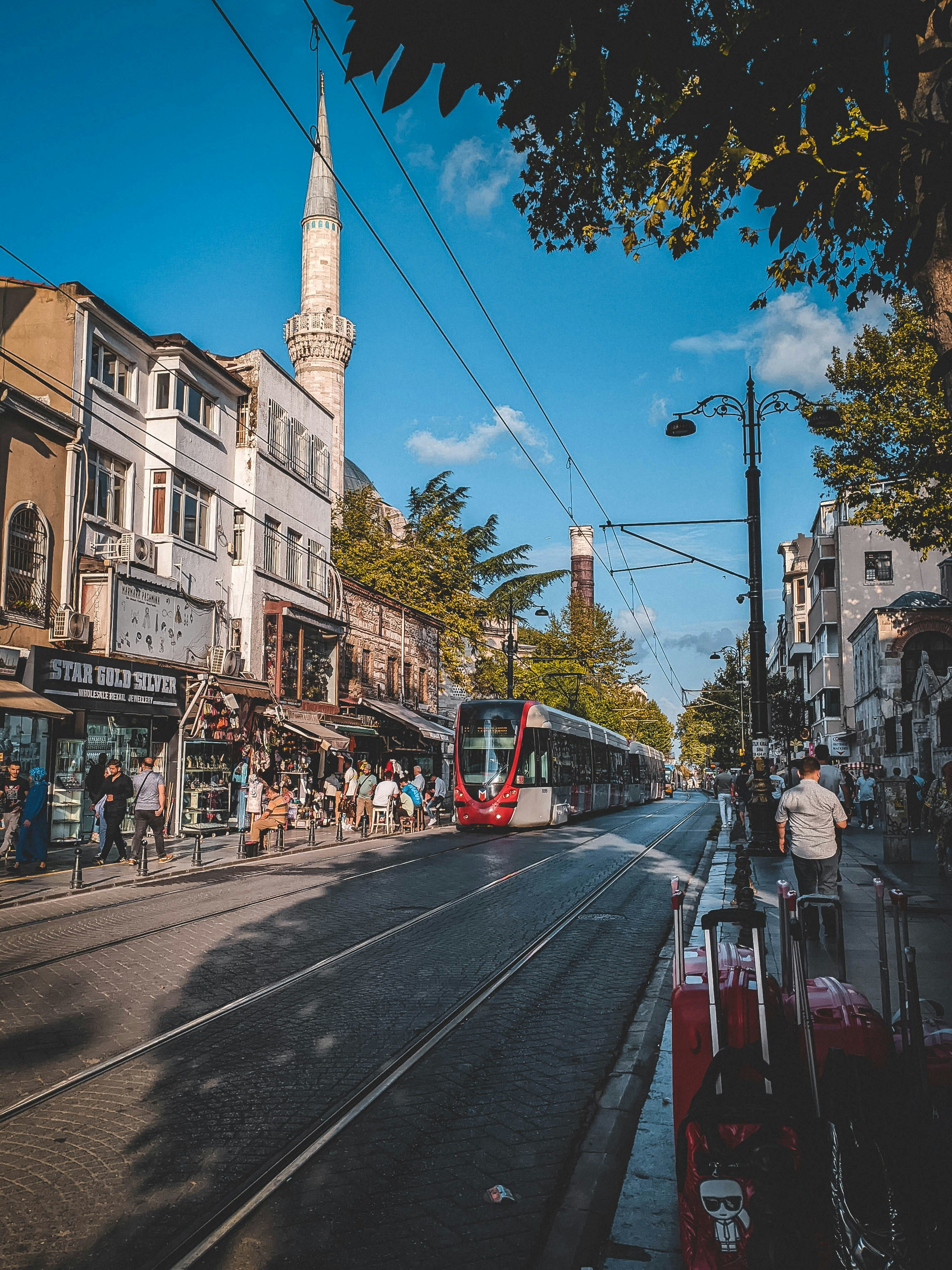 Red Tram Threads a Sunlit Istiklal Street
