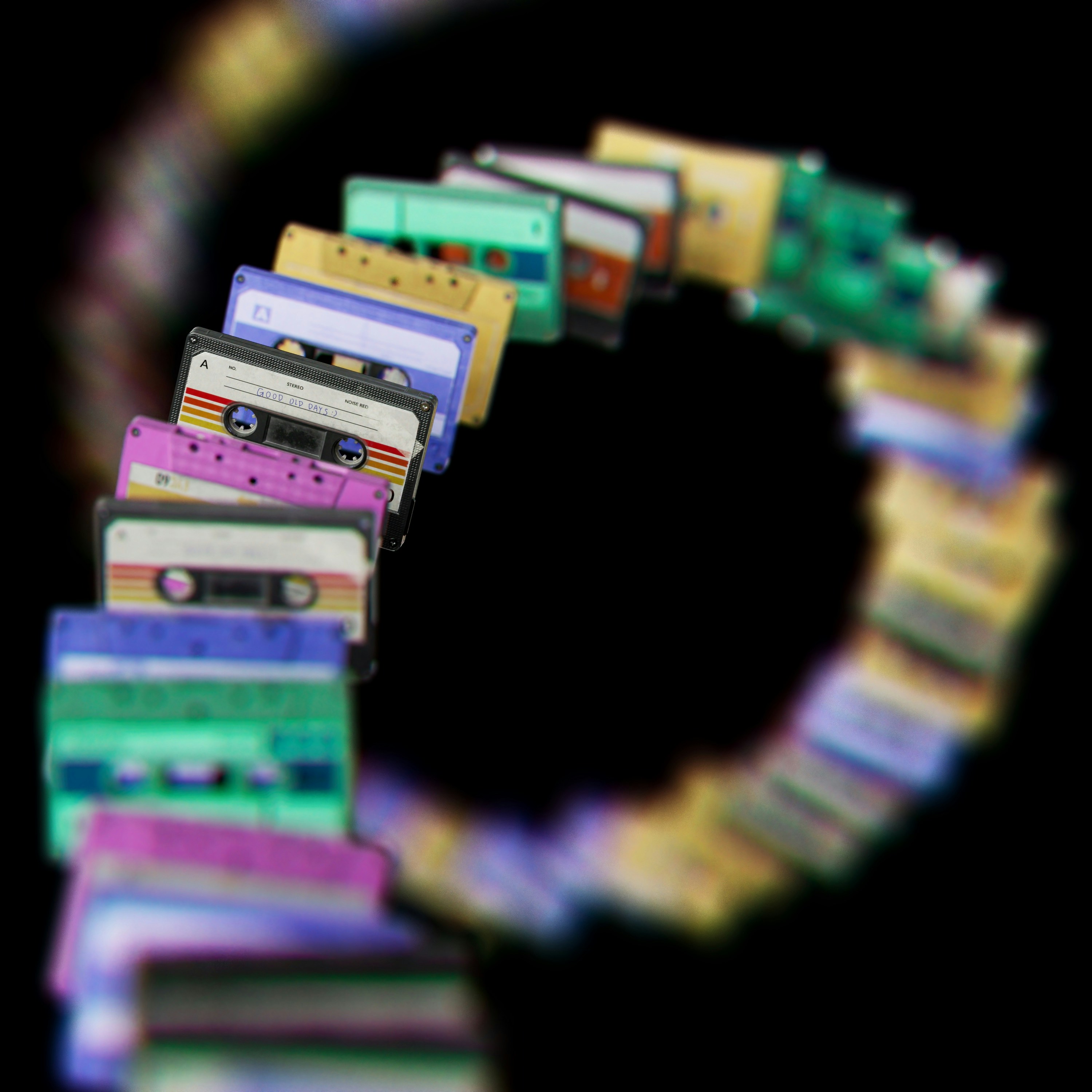 A group of cassette tapes arranged in the shape of a spiral photo ...