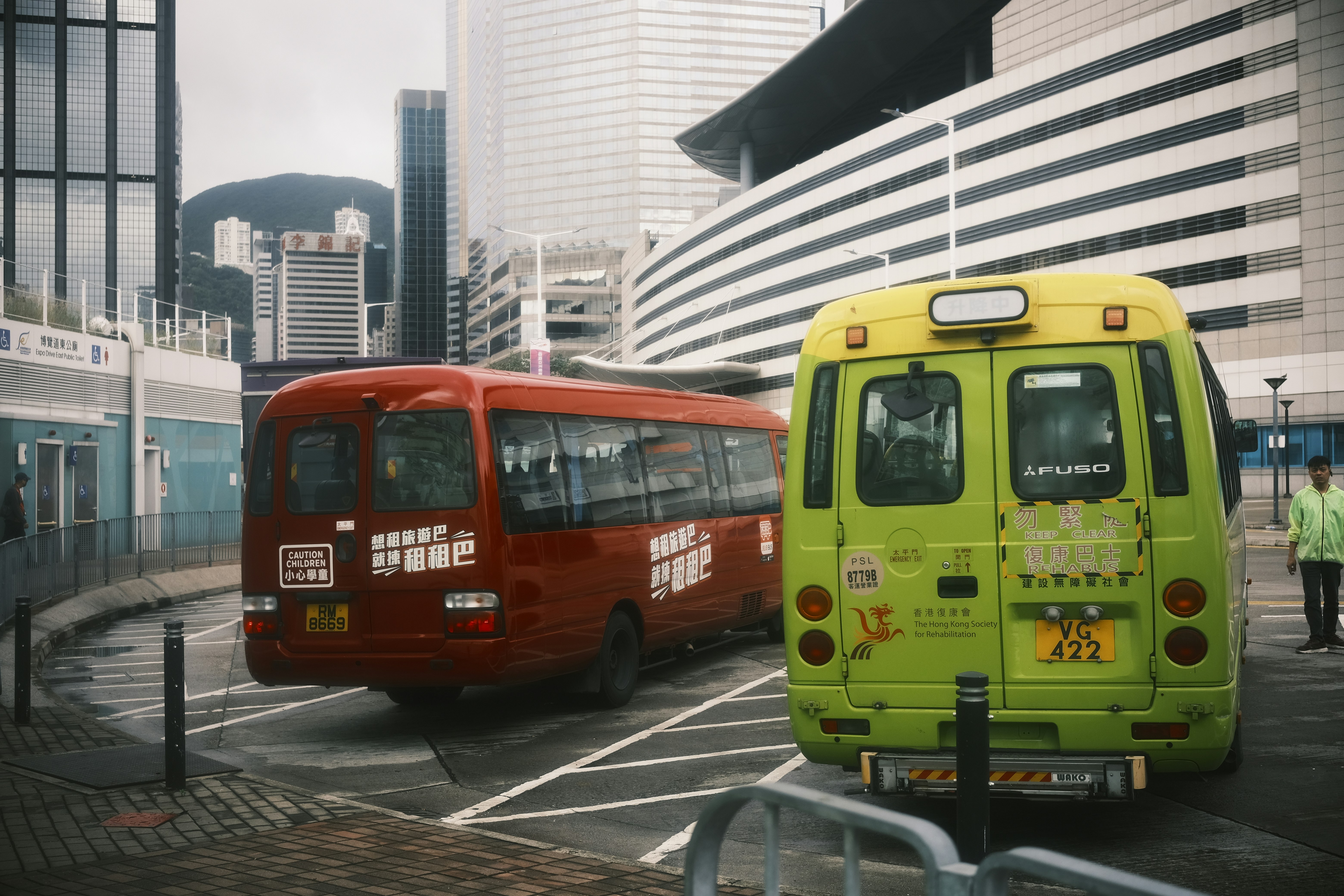 A couple of buses that are sitting in the street photo – Free Bus Image ...