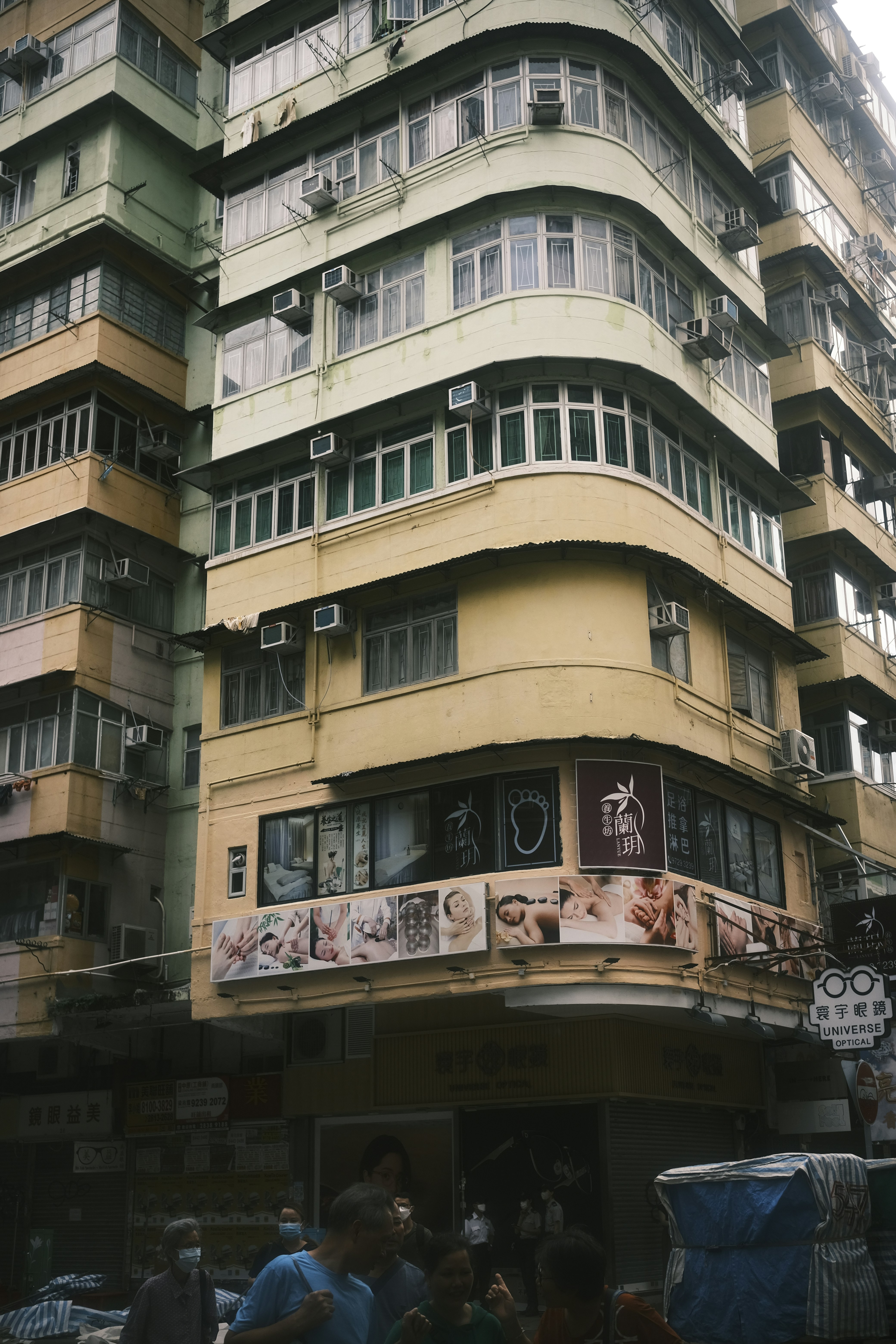 A tall building with lots of windows and balconies photo – Free Hong ...